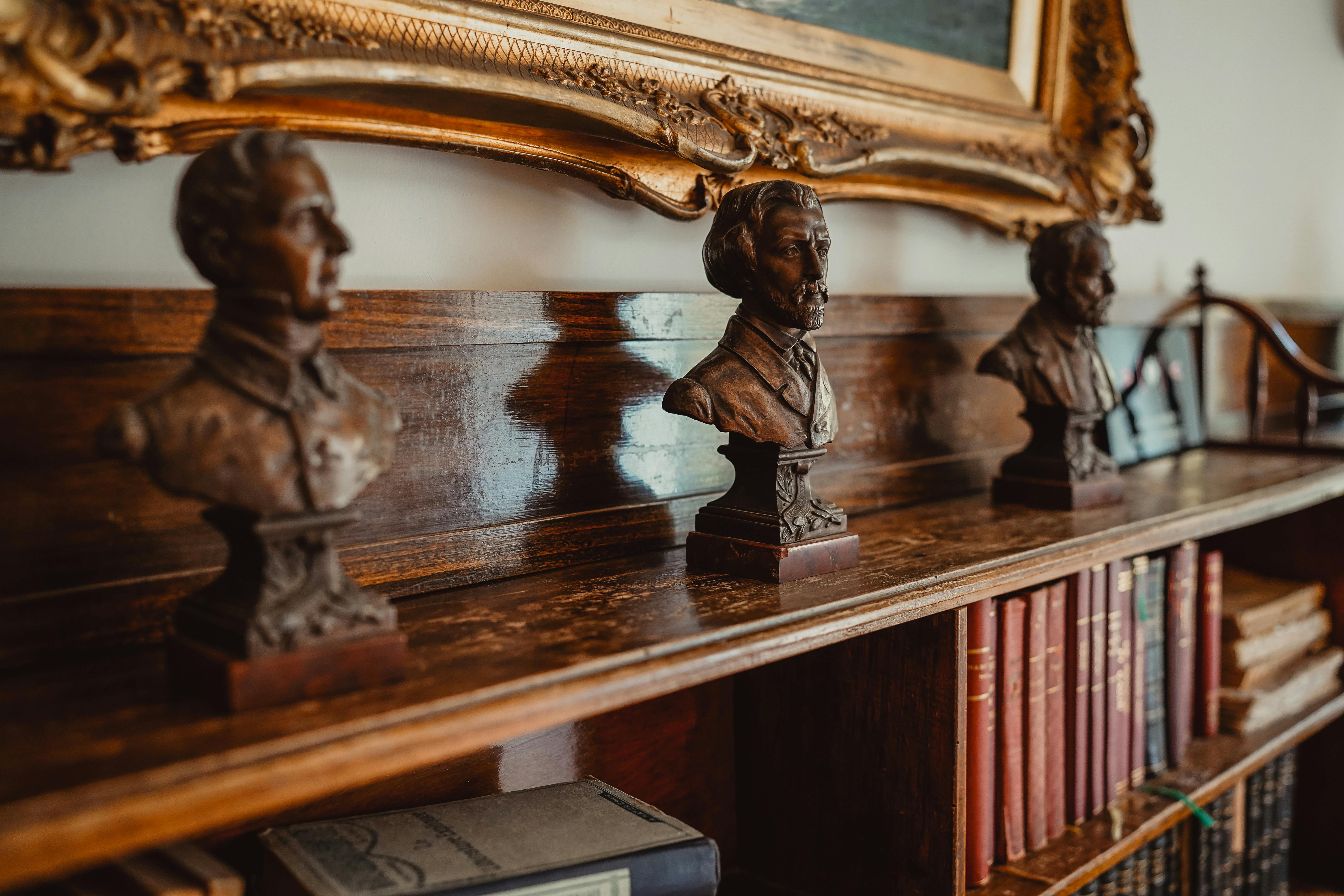 Traditional Busts on a Cabinet · Free Stock Photo