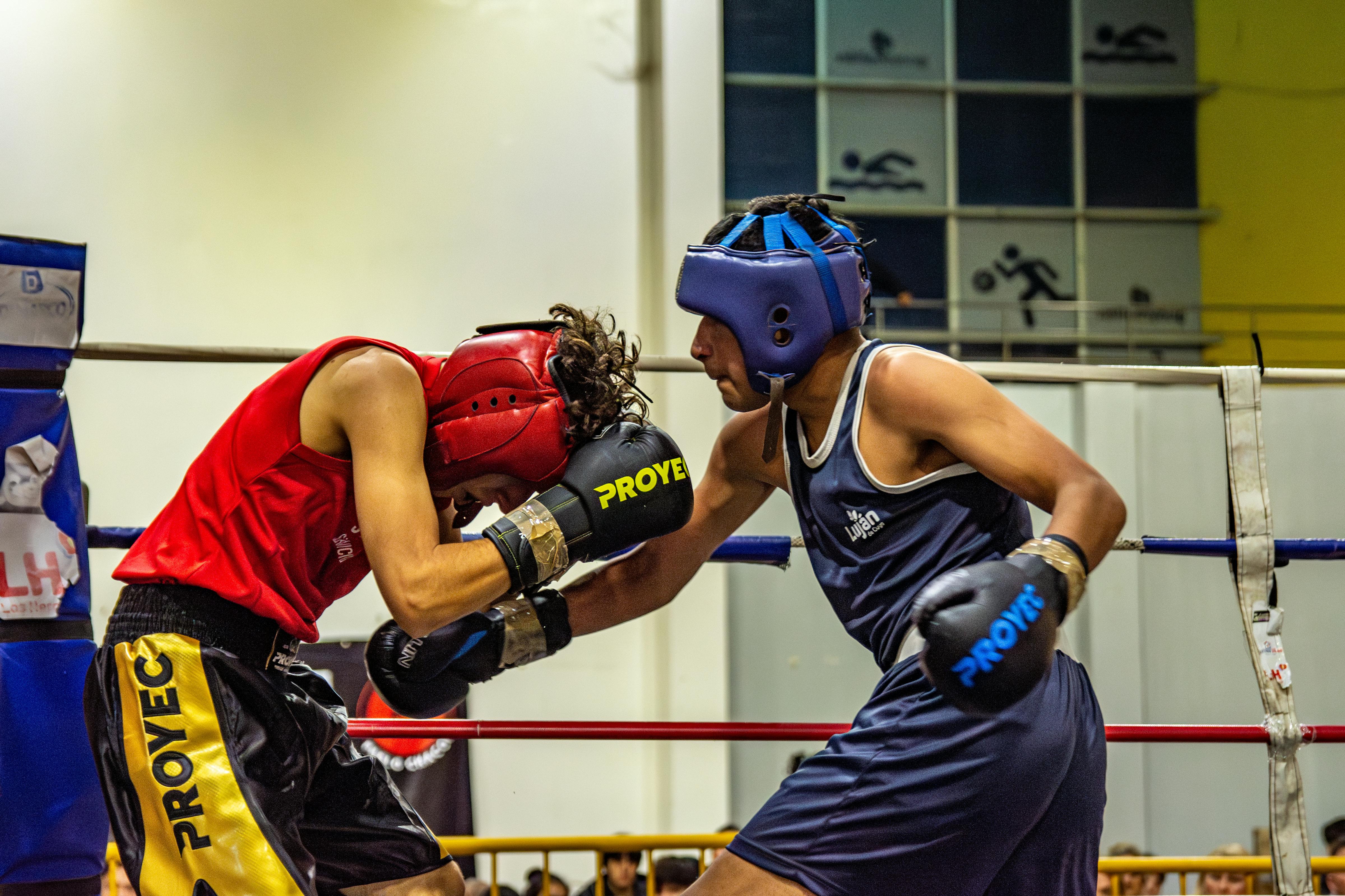 Two boxers in action during a boxing match · Free Stock Photo