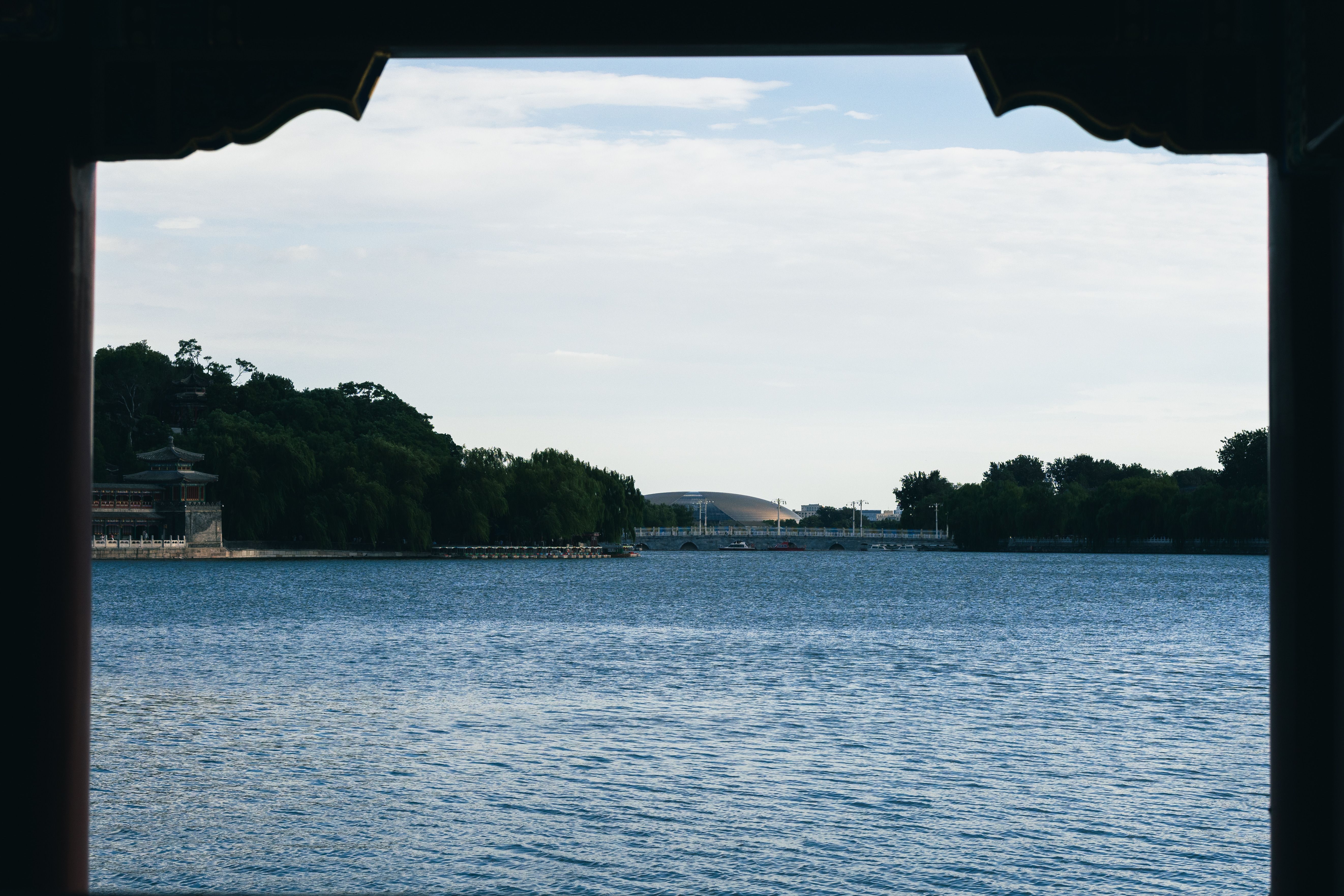 A view of a lake from a window · Free Stock Photo