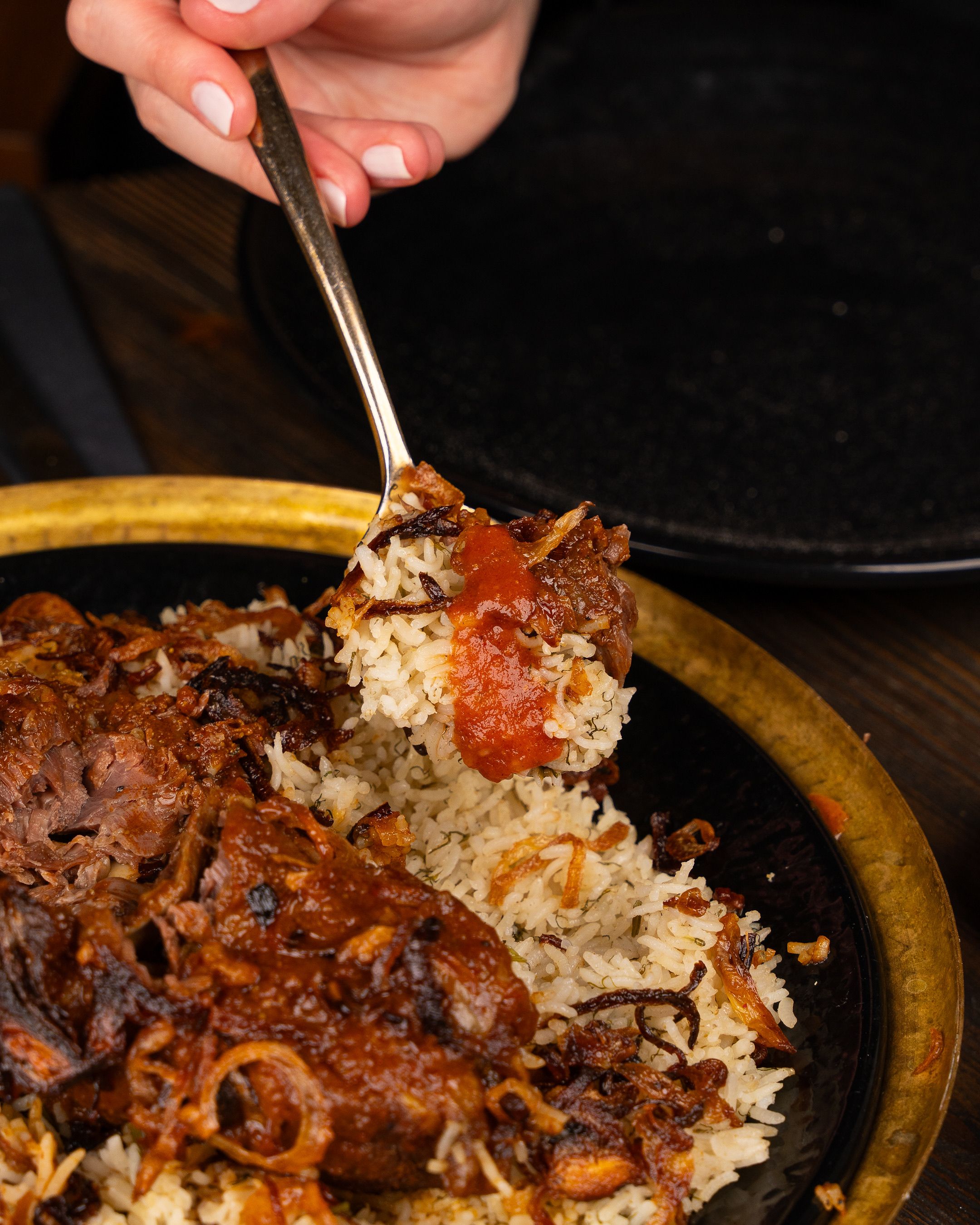 Person Eating Rice with Meat · Free Stock Photo
