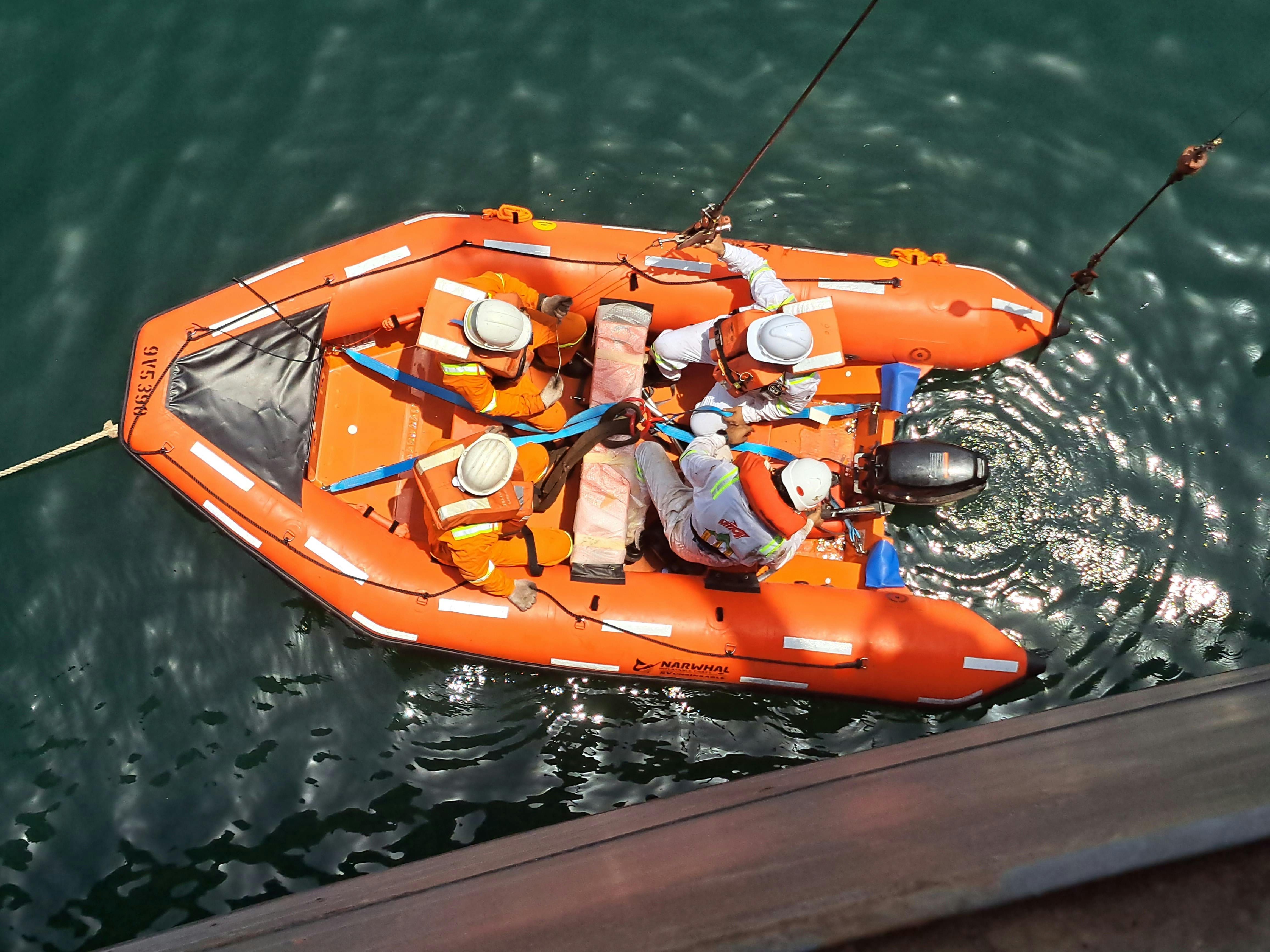Top View of Men Sitting in a Motorboat · Free Stock Photo