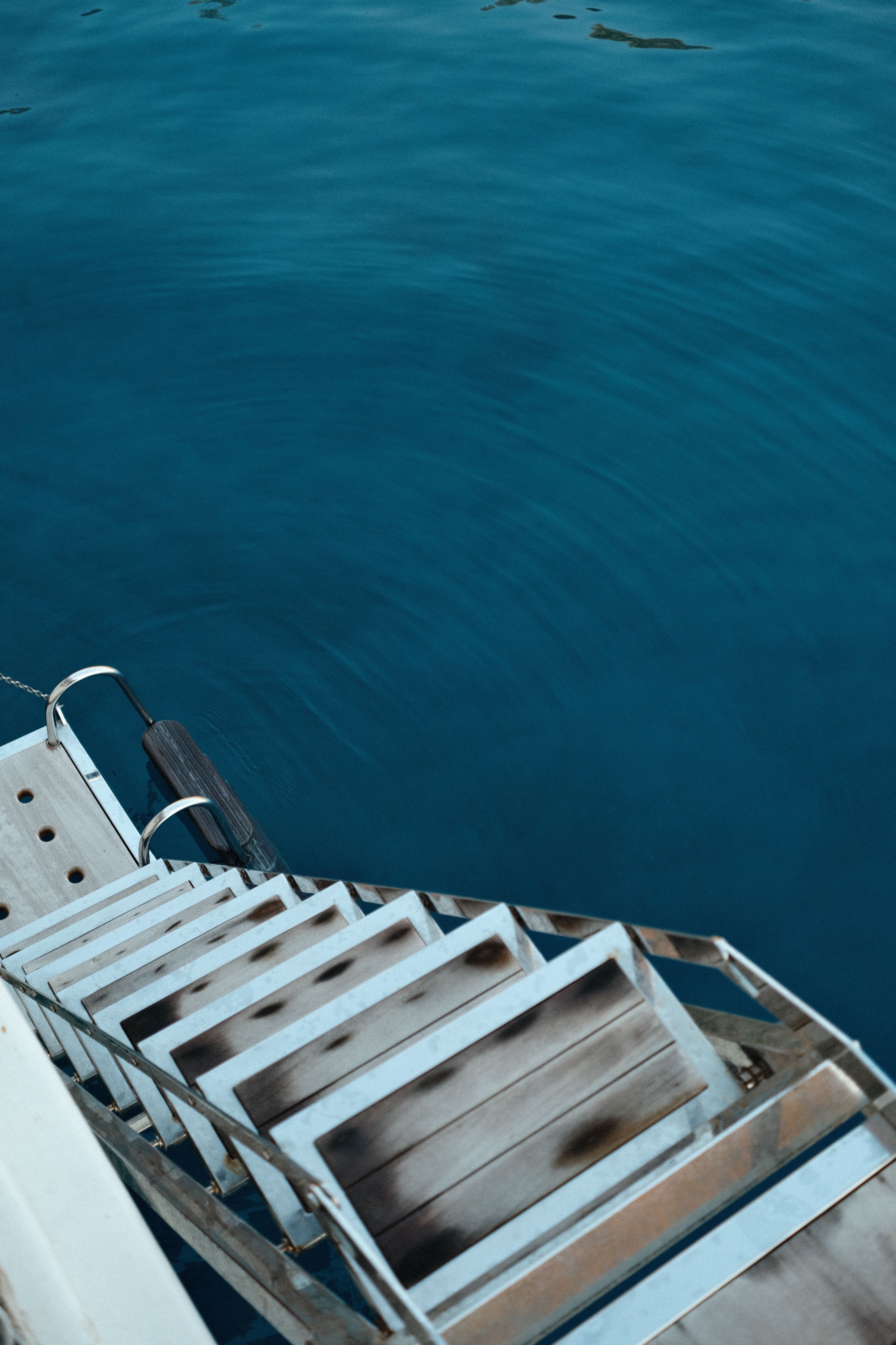 A boat with stairs leading down to the water · Free Stock Photo