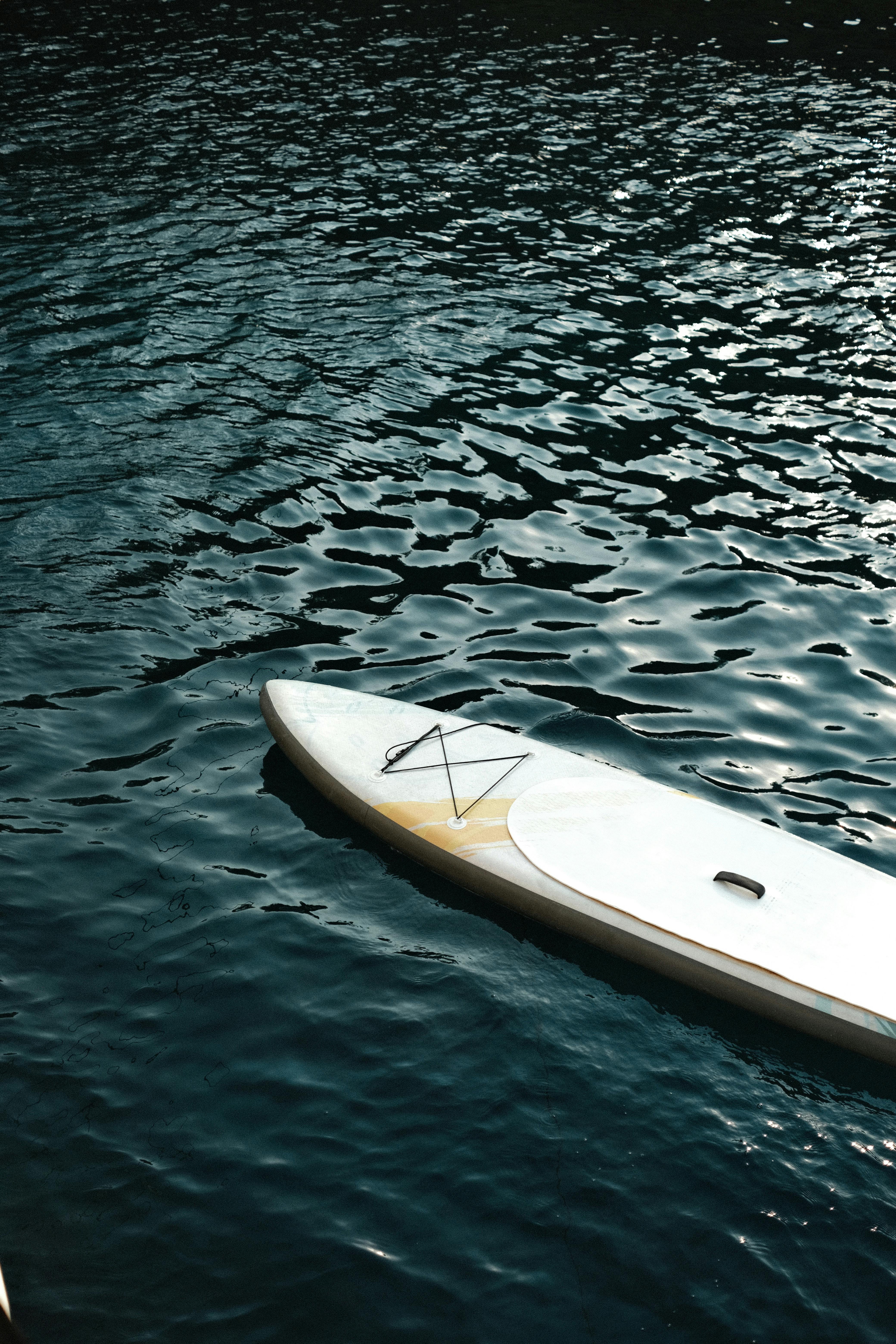 Surfboard Floating on Water · Free Stock Photo