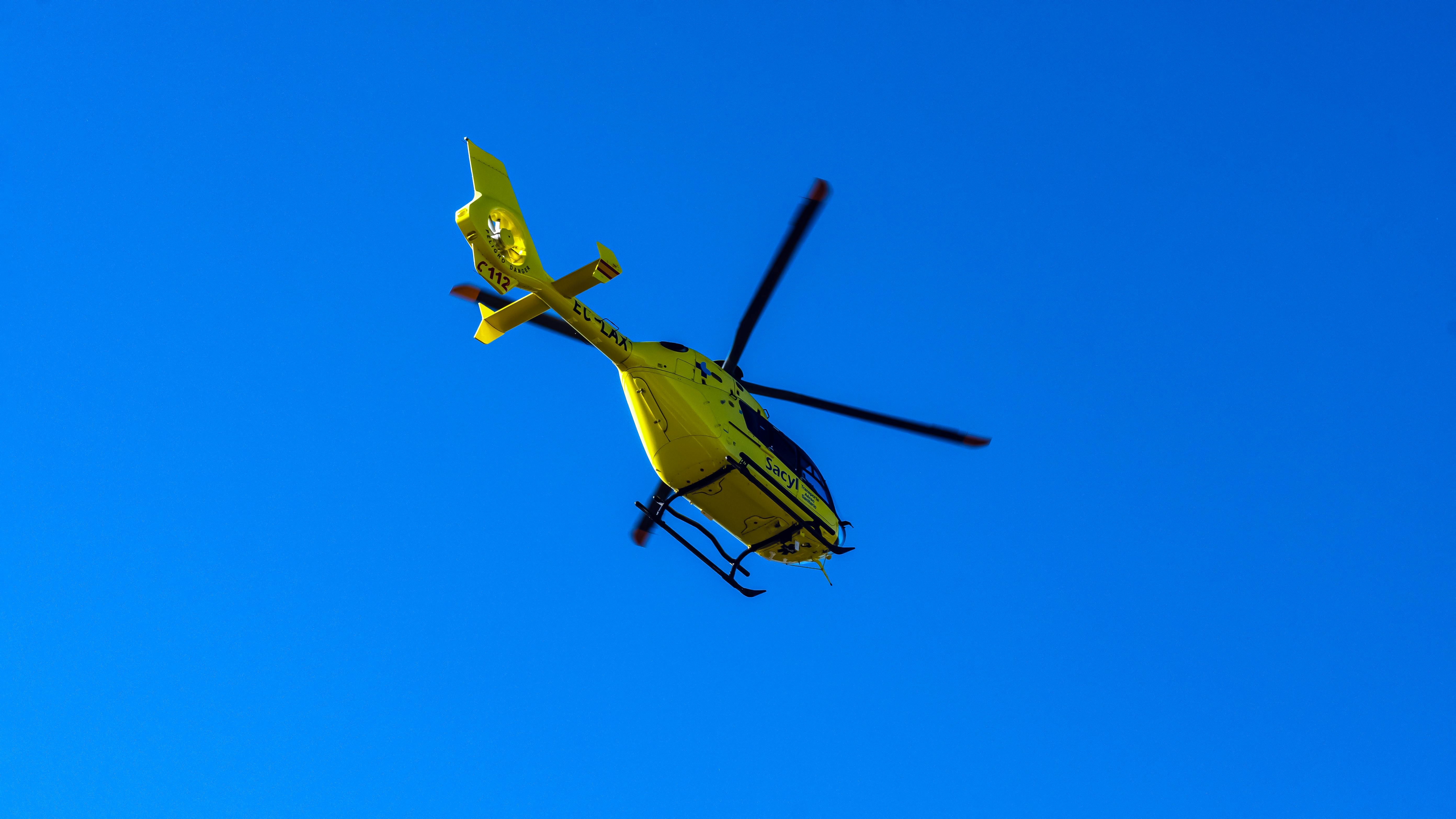 Helicopter Flying Over Body Of Water · Free Stock Photo