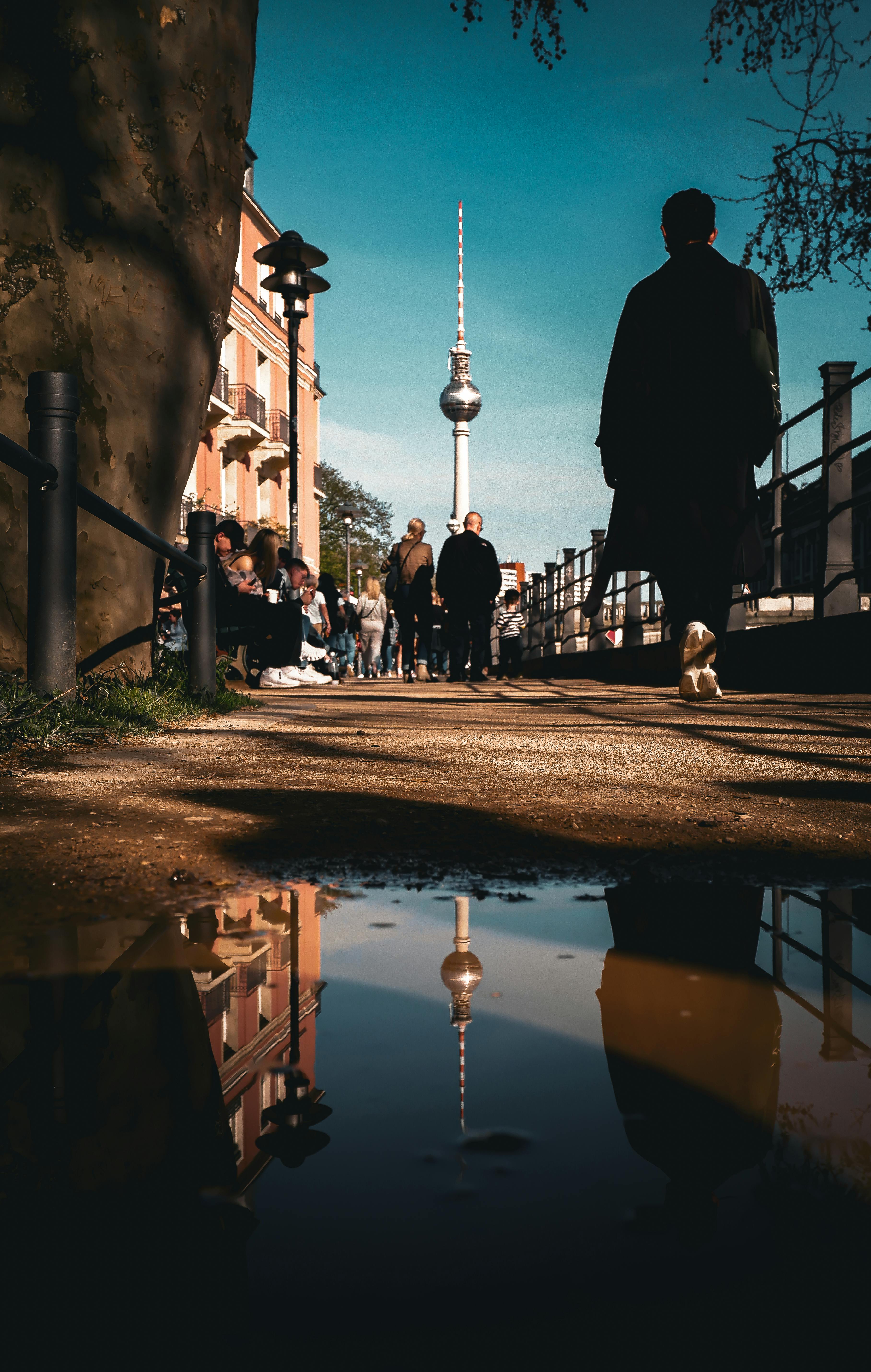 Fernsehturm Reflecting in a Street Puddle · Free Stock Photo