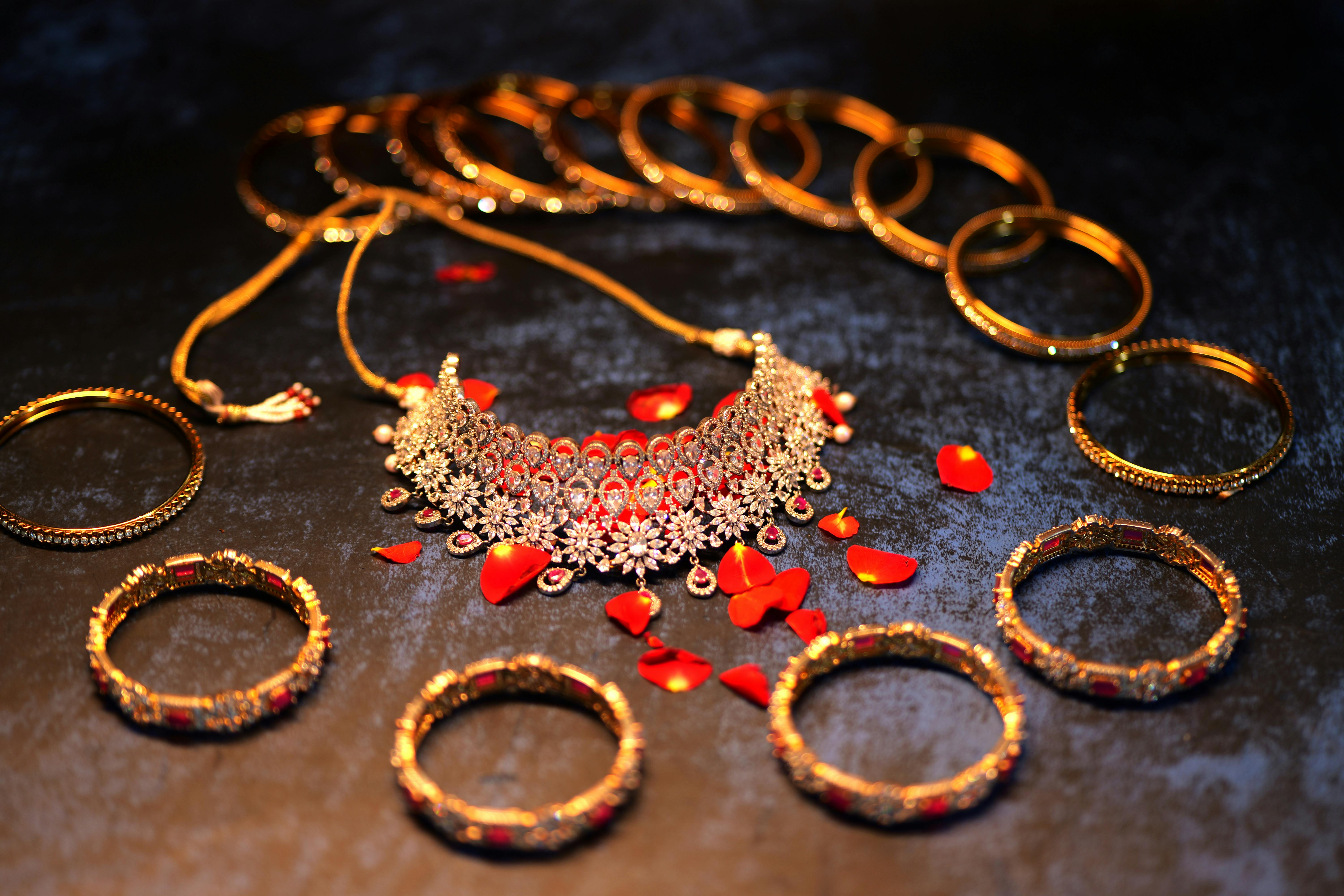 Close-up of a Necklace and Rings with Gems · Free Stock Photo