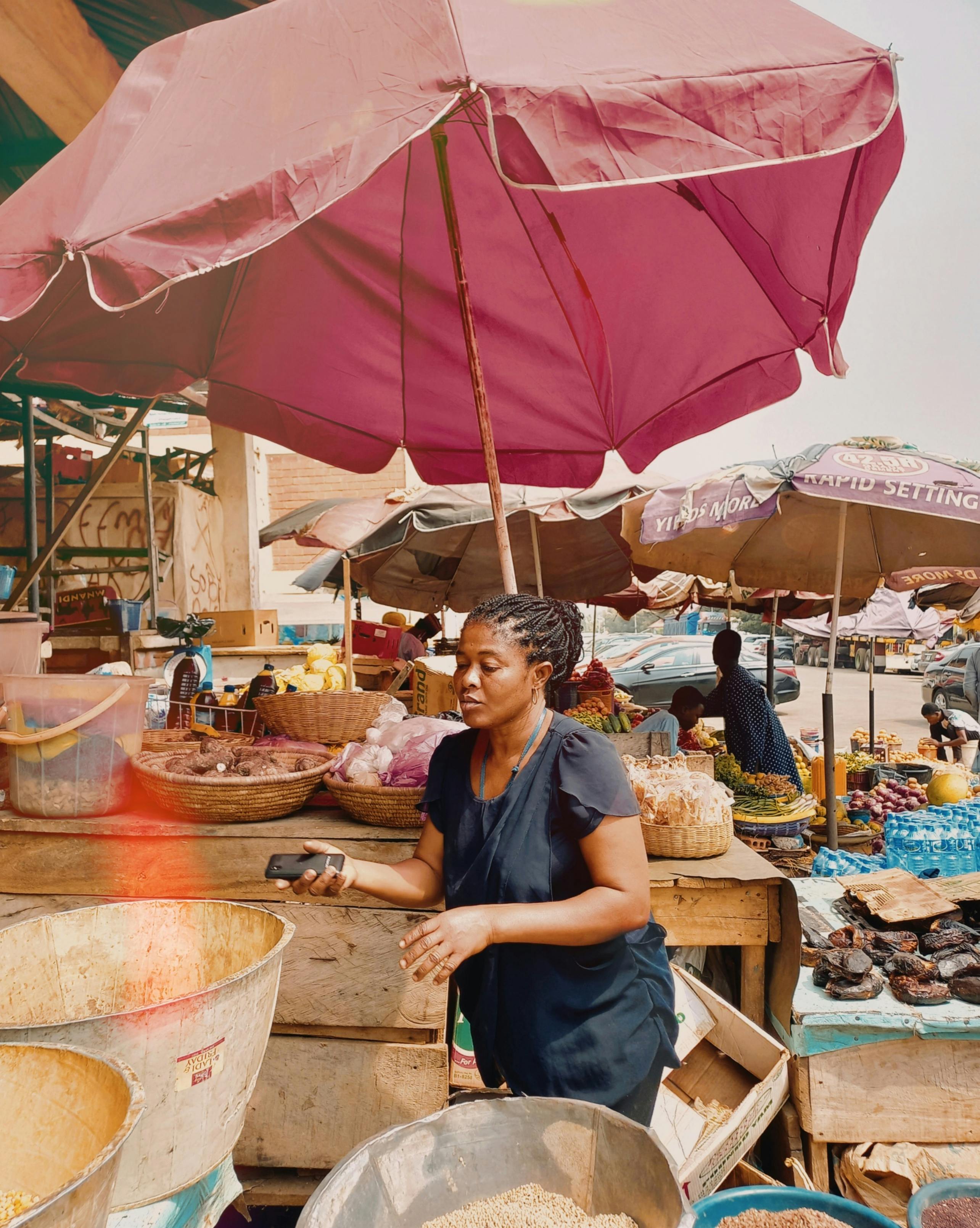Vibrant Local Market Scene with Vendor · Free Stock Photo