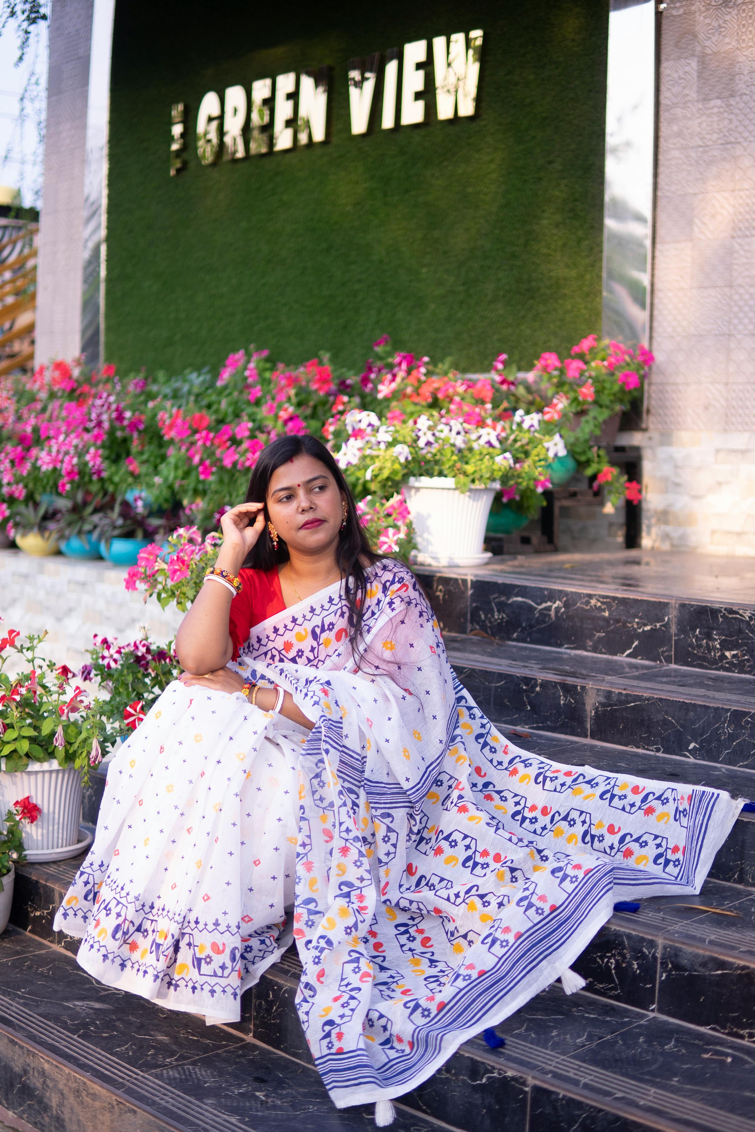 Bride Sitting in Traditional Dress on Stairs · Free Stock Photo