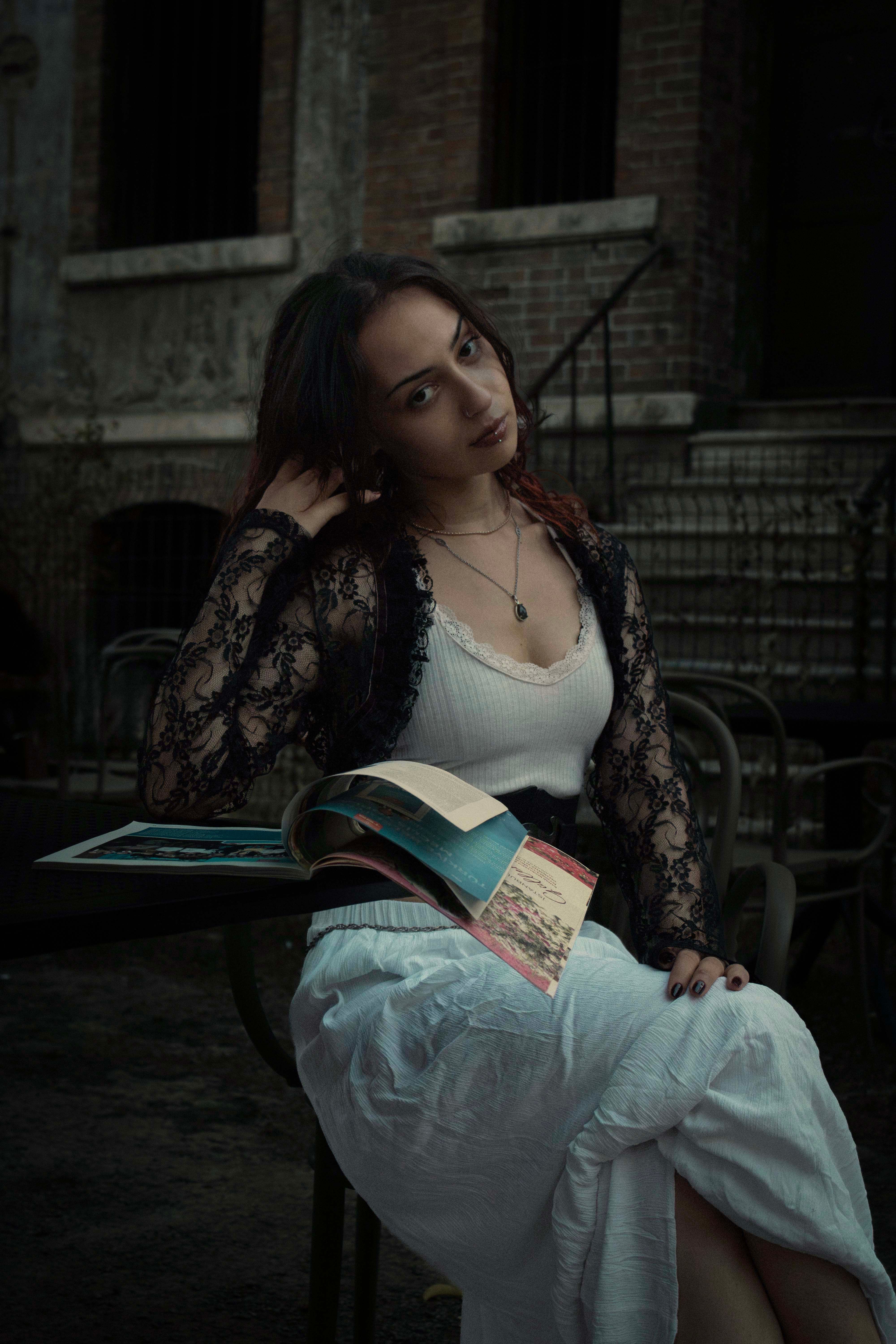 Portrait of Woman Sitting with Book · Free Stock Photo