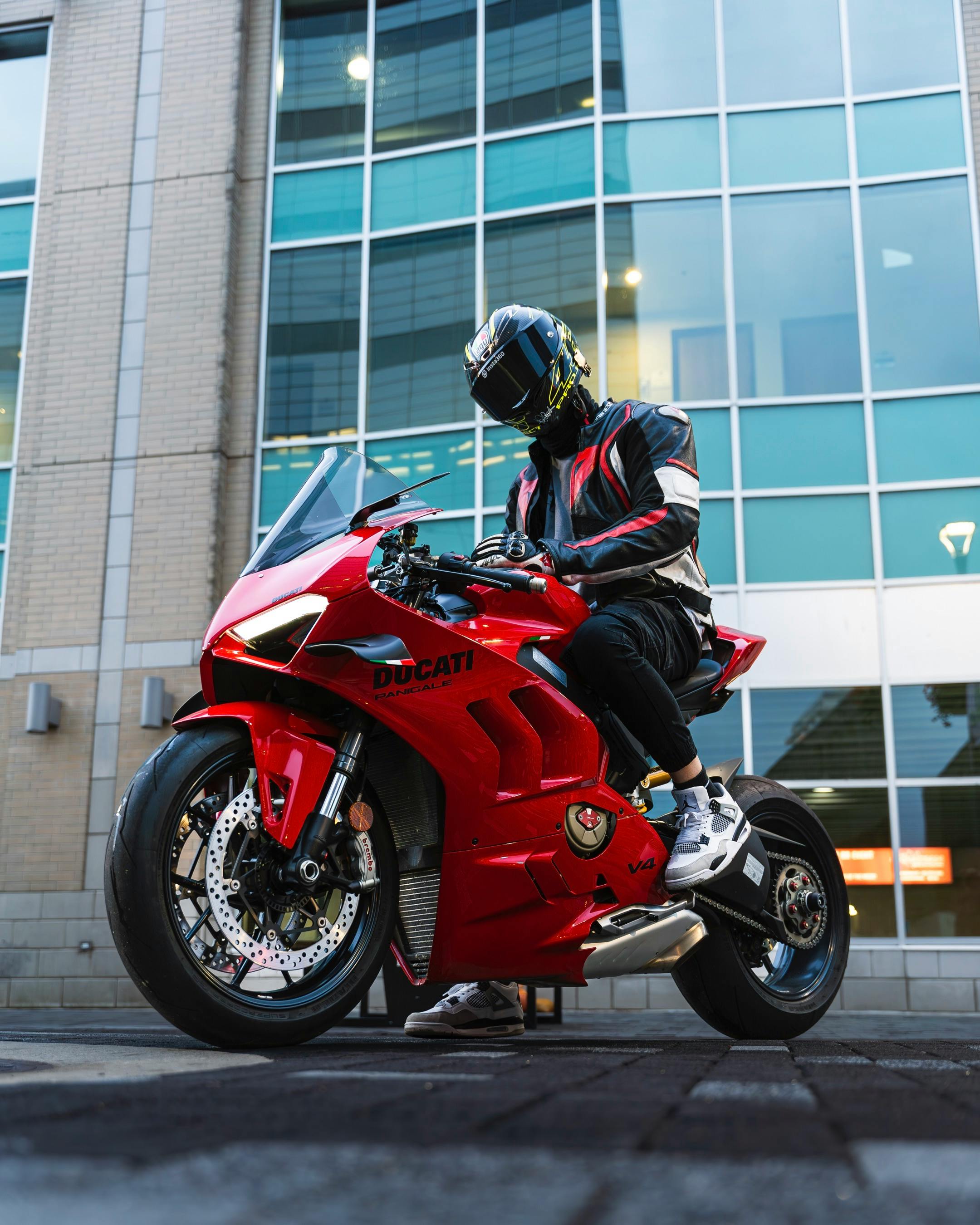 Motorcyclist on Red Motorcycle on Street in City · Free Stock Photo