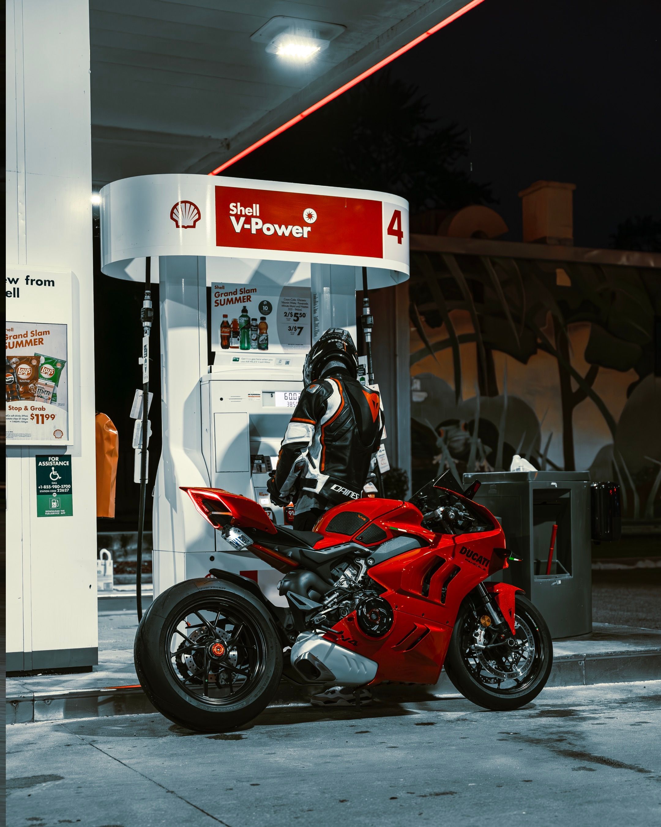 Biker with Motorcycle at Gas Station · Free Stock Photo