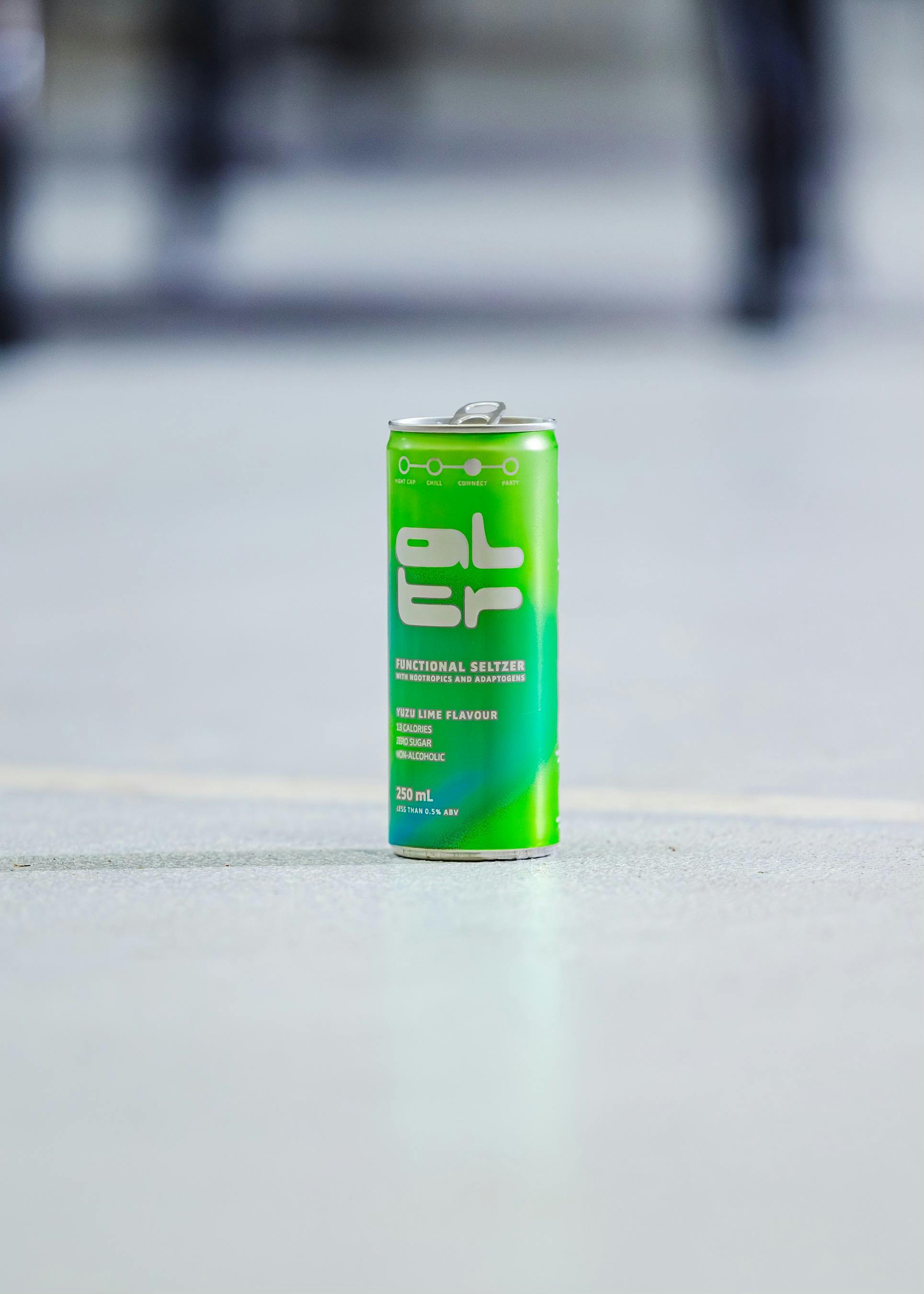 Green Can of Energy Drink on Floor · Free Stock Photo