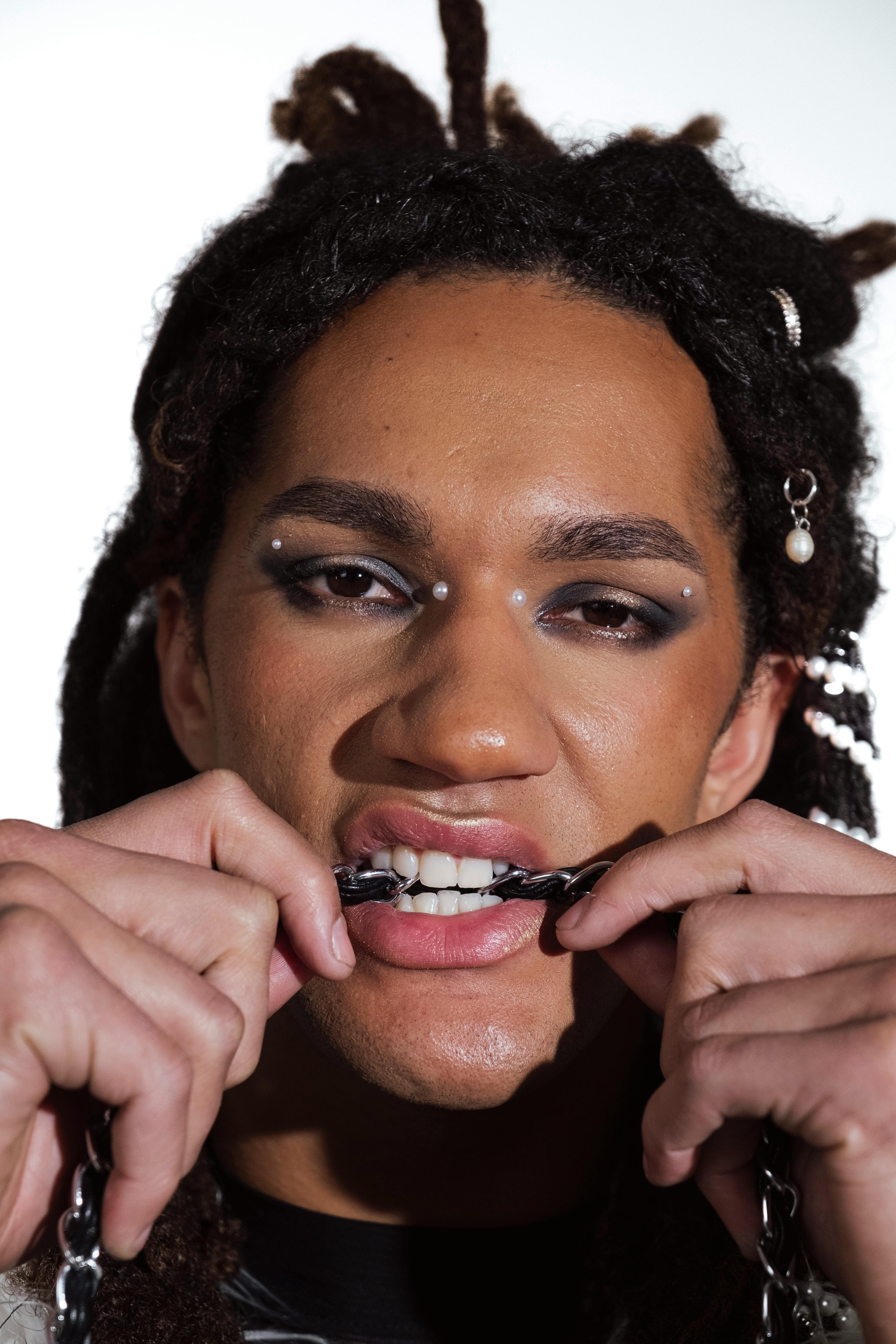 Man Biting Metal Chain · Free Stock Photo