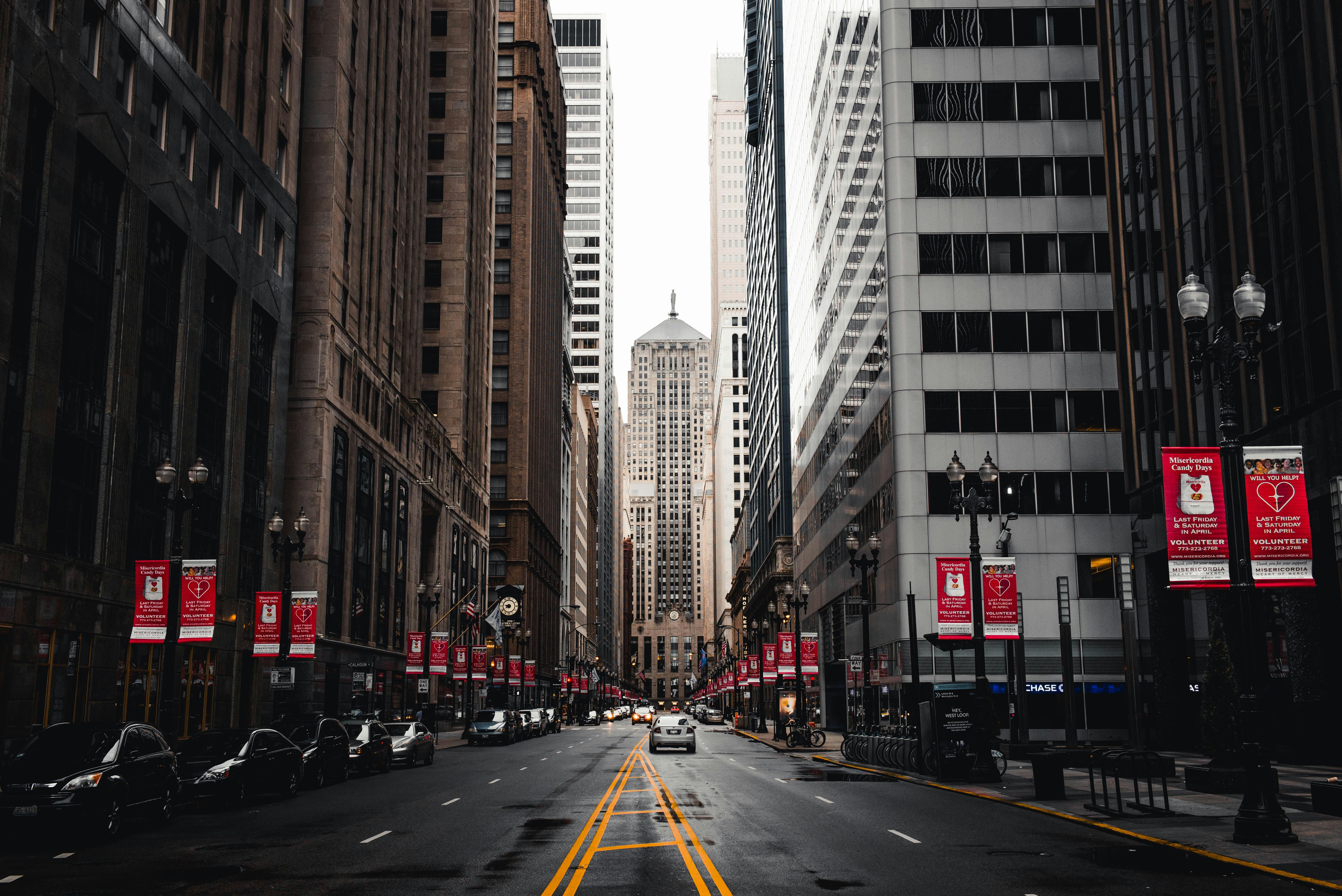 Asphalt Road Between Buildings · Free Stock Photo