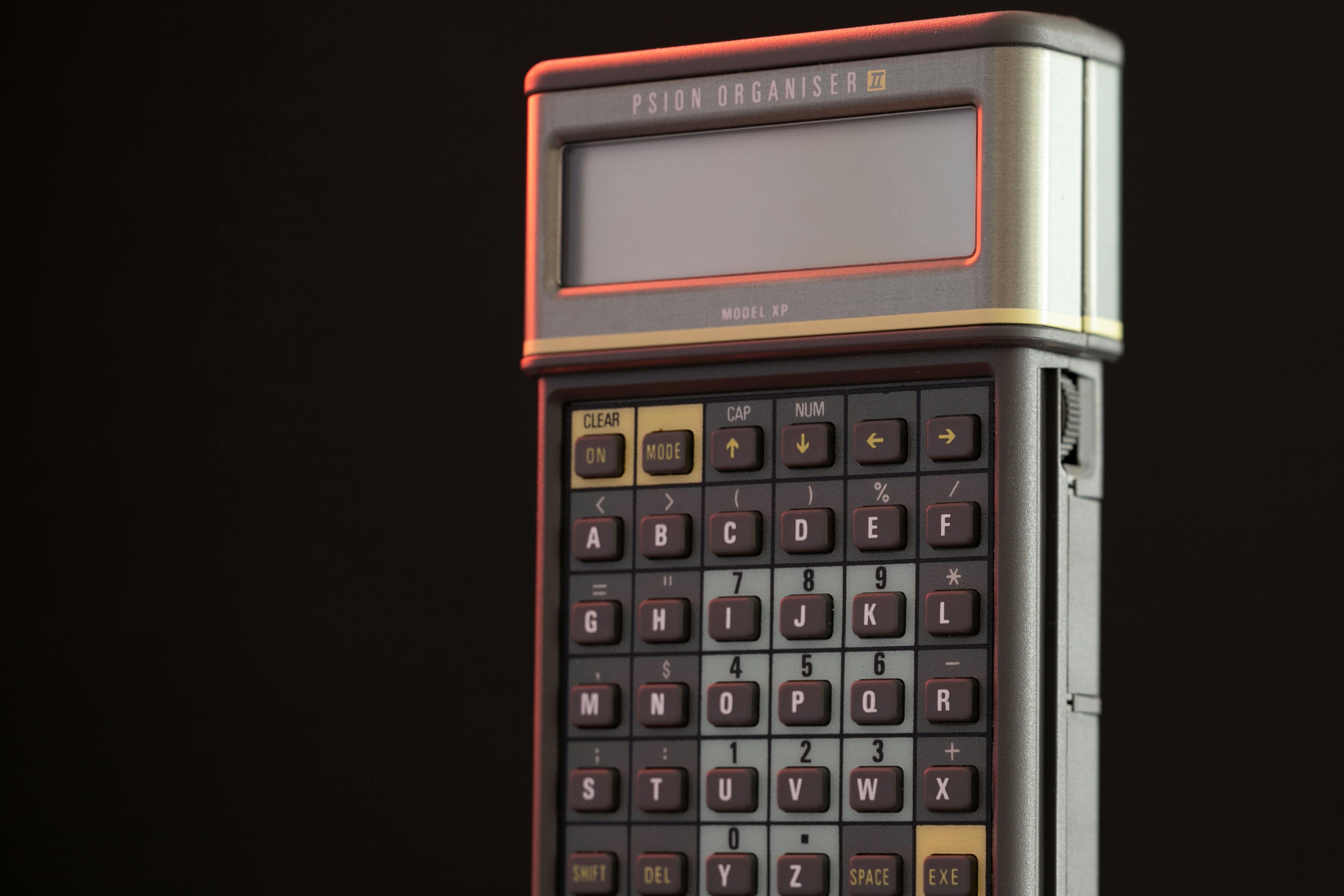 Calculator on Black Background · Free Stock Photo