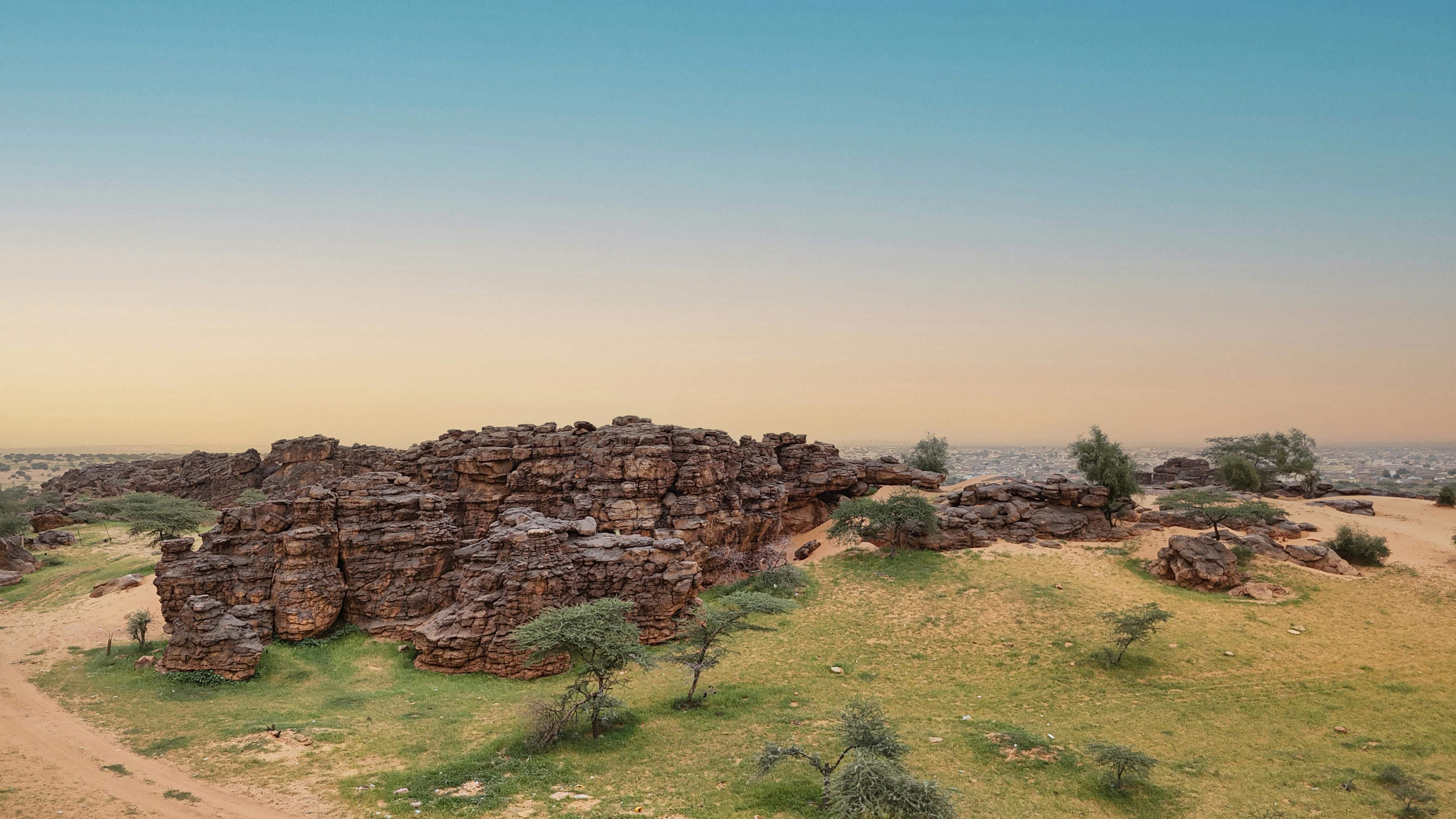 Rocks and Trees in Arid Countryside · Free Stock Photo