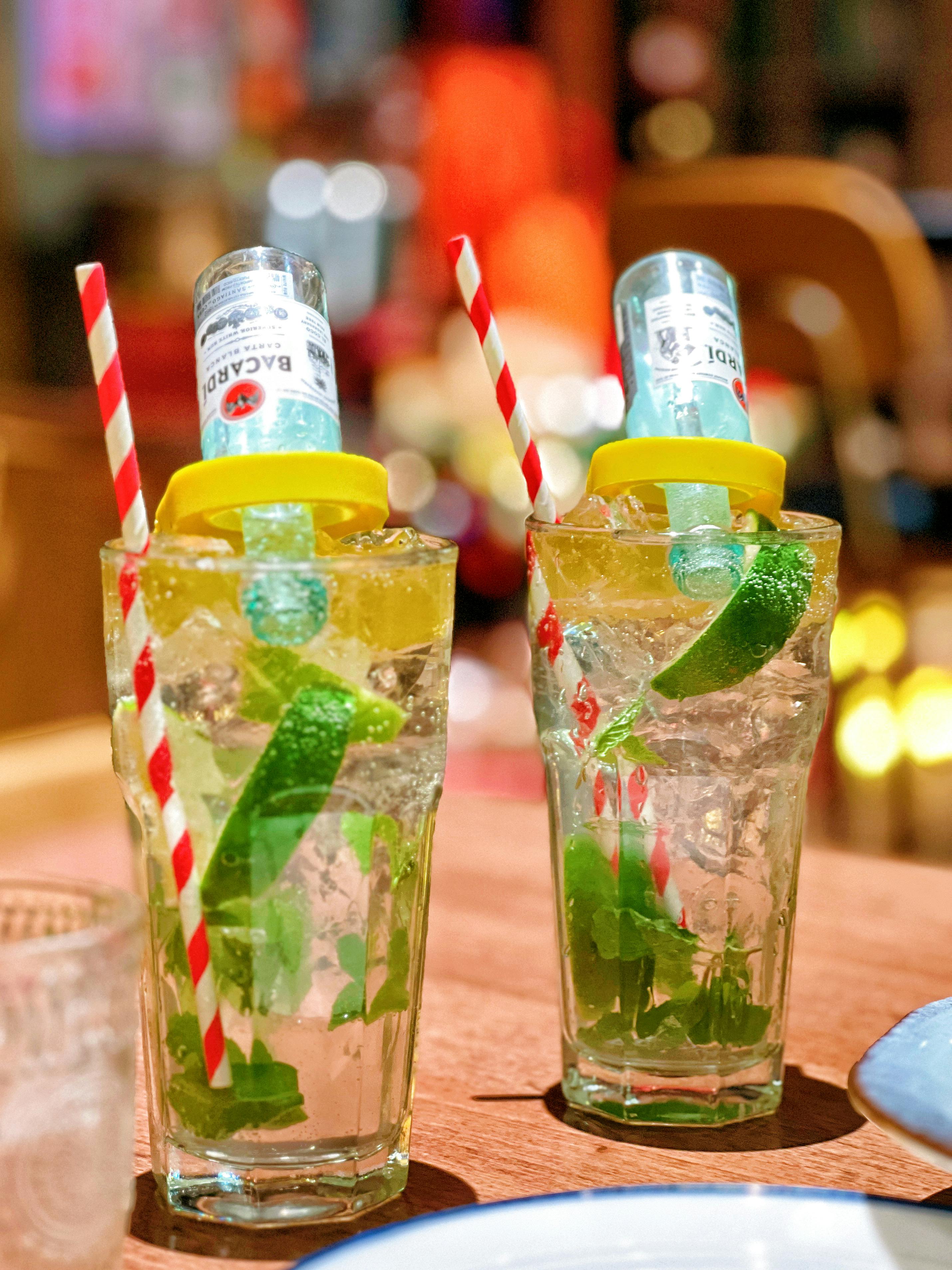 Two Clear Drinking Glass With Juice and Black Straw · Free Stock Photo