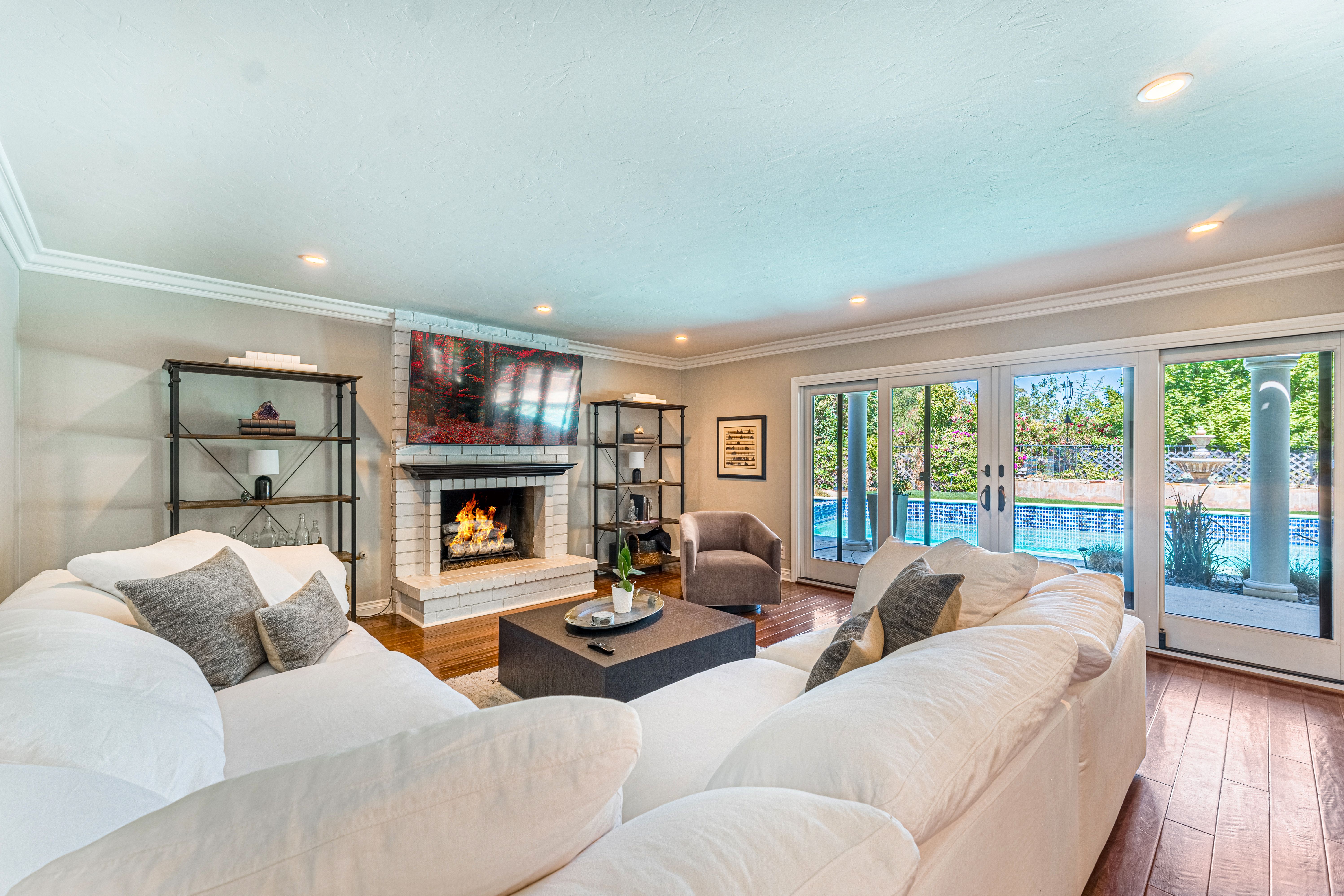 Large Couch in Spacious Living Room with view of Swimming Pool · Free ...