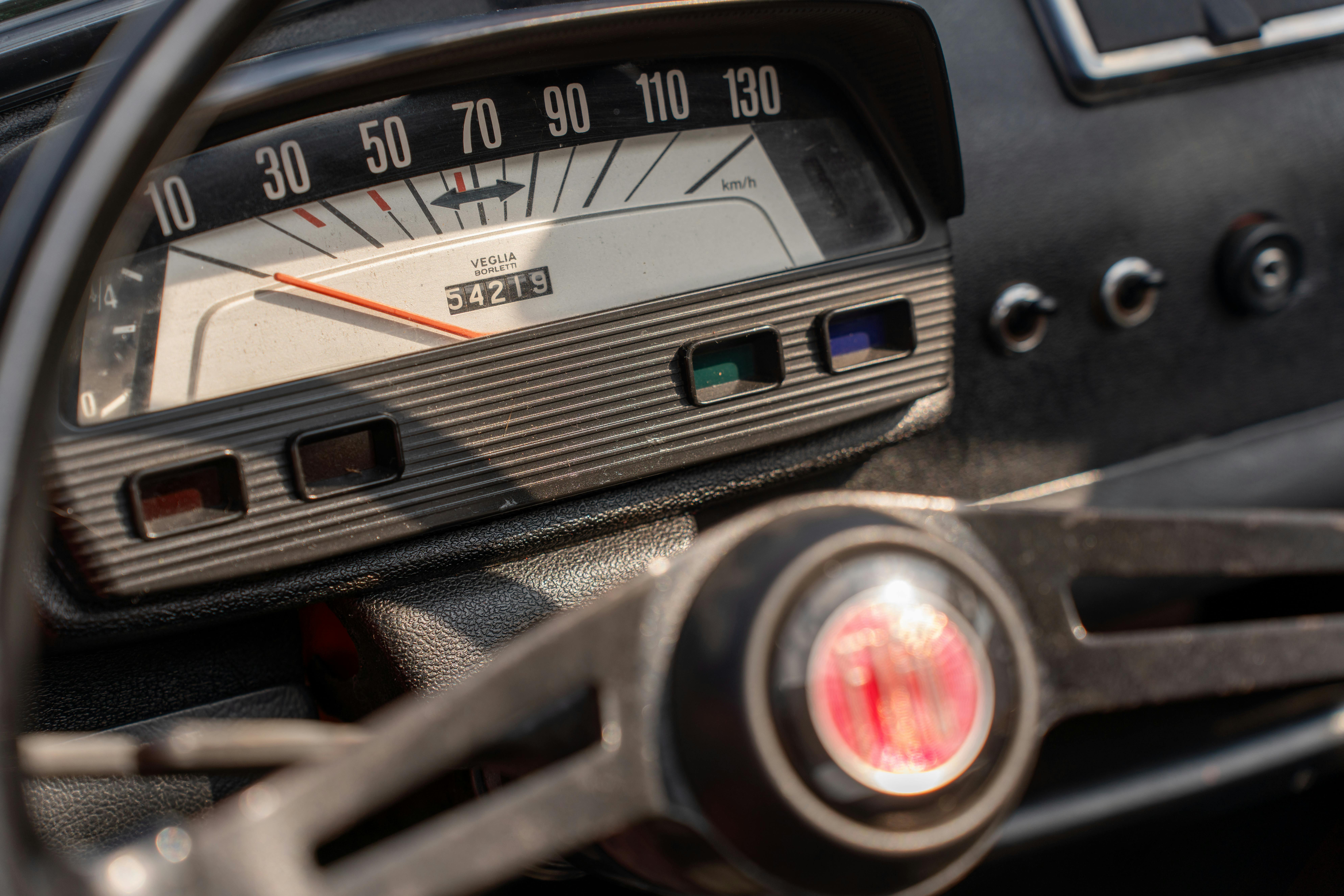 A close up of a dashboard with a speedometer · Free Stock Photo