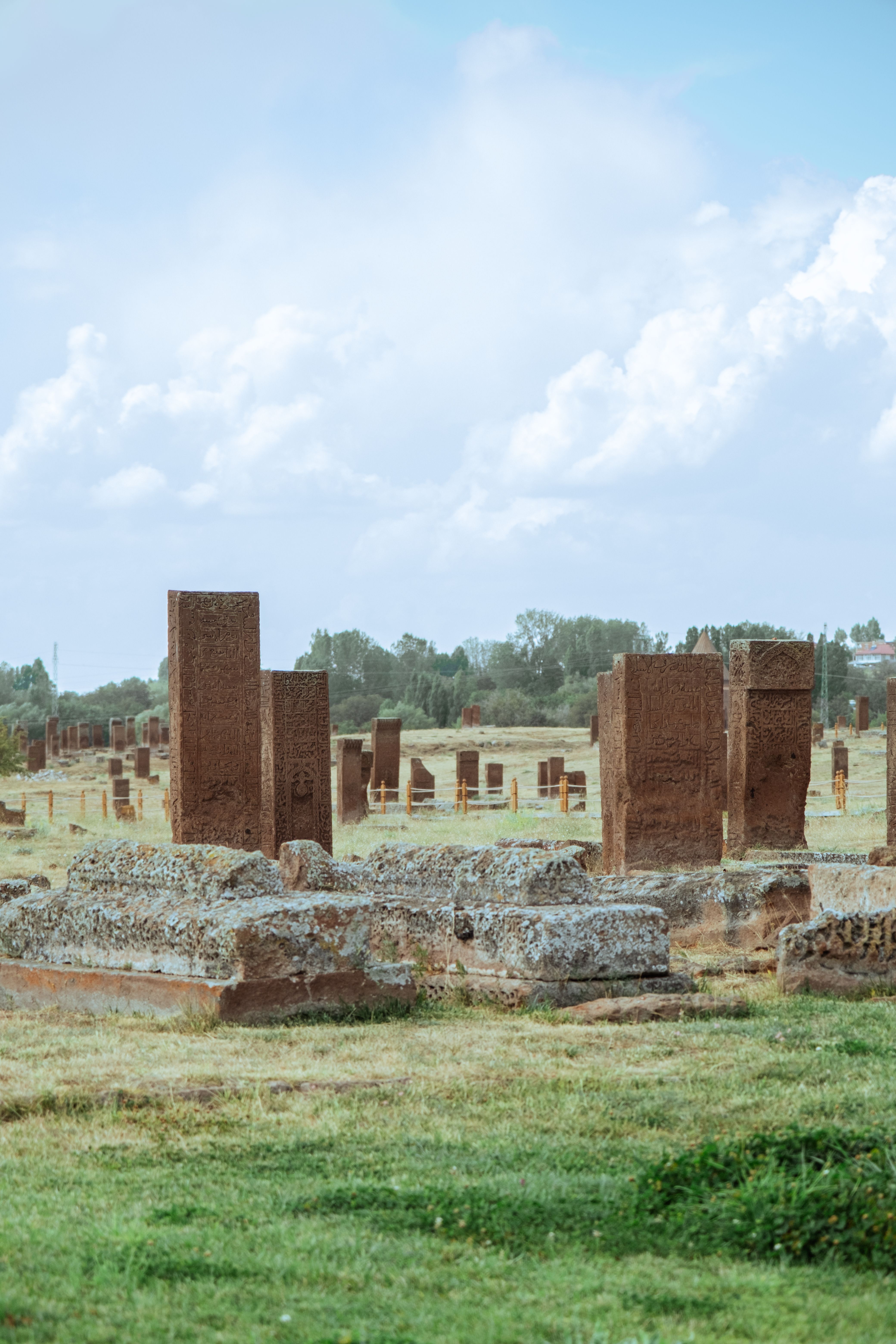 The ruins of a large stone structure in a field · Free Stock Photo