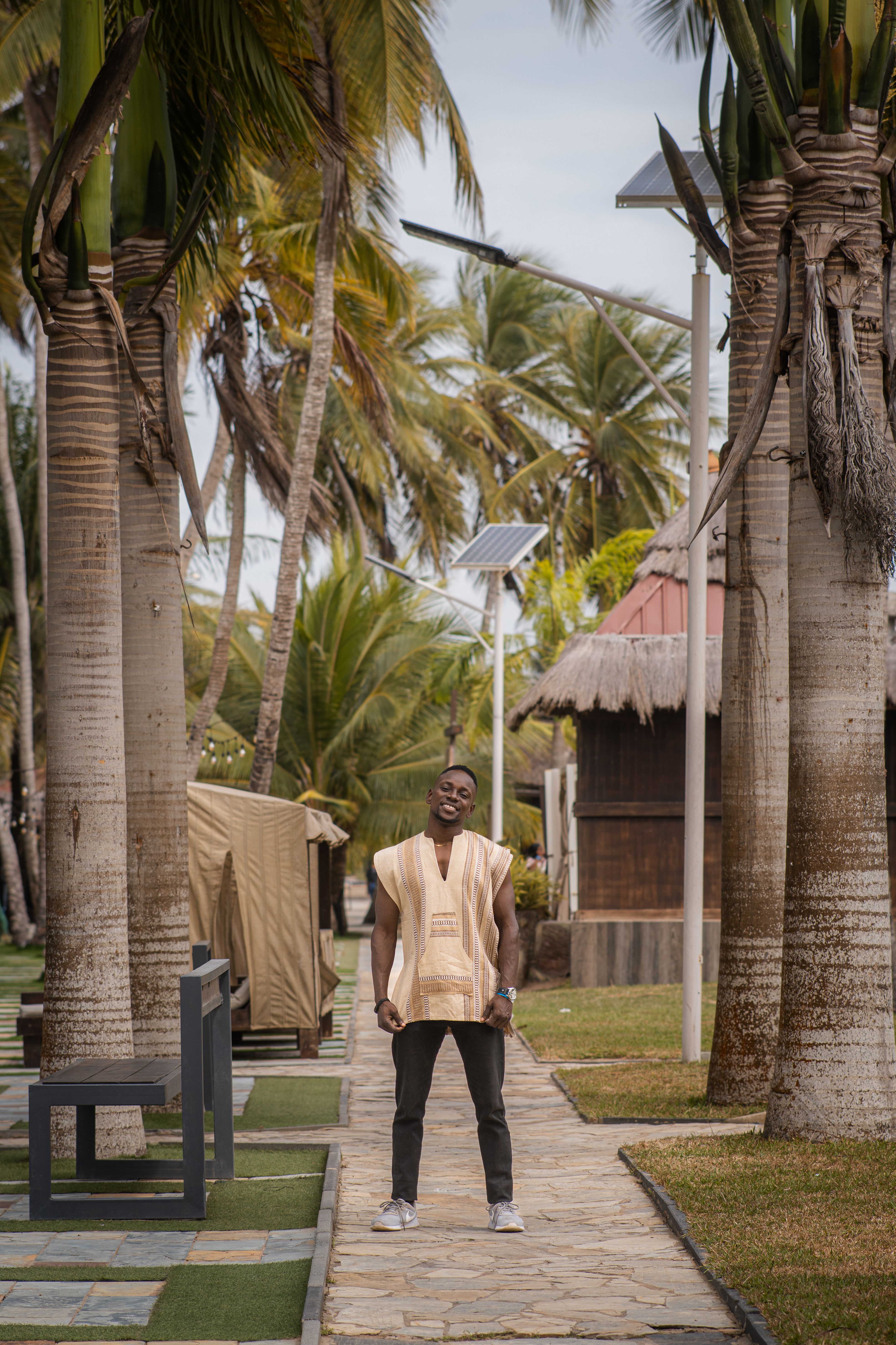 Man Posing in a Resort with Palm Trees · Free Stock Photo