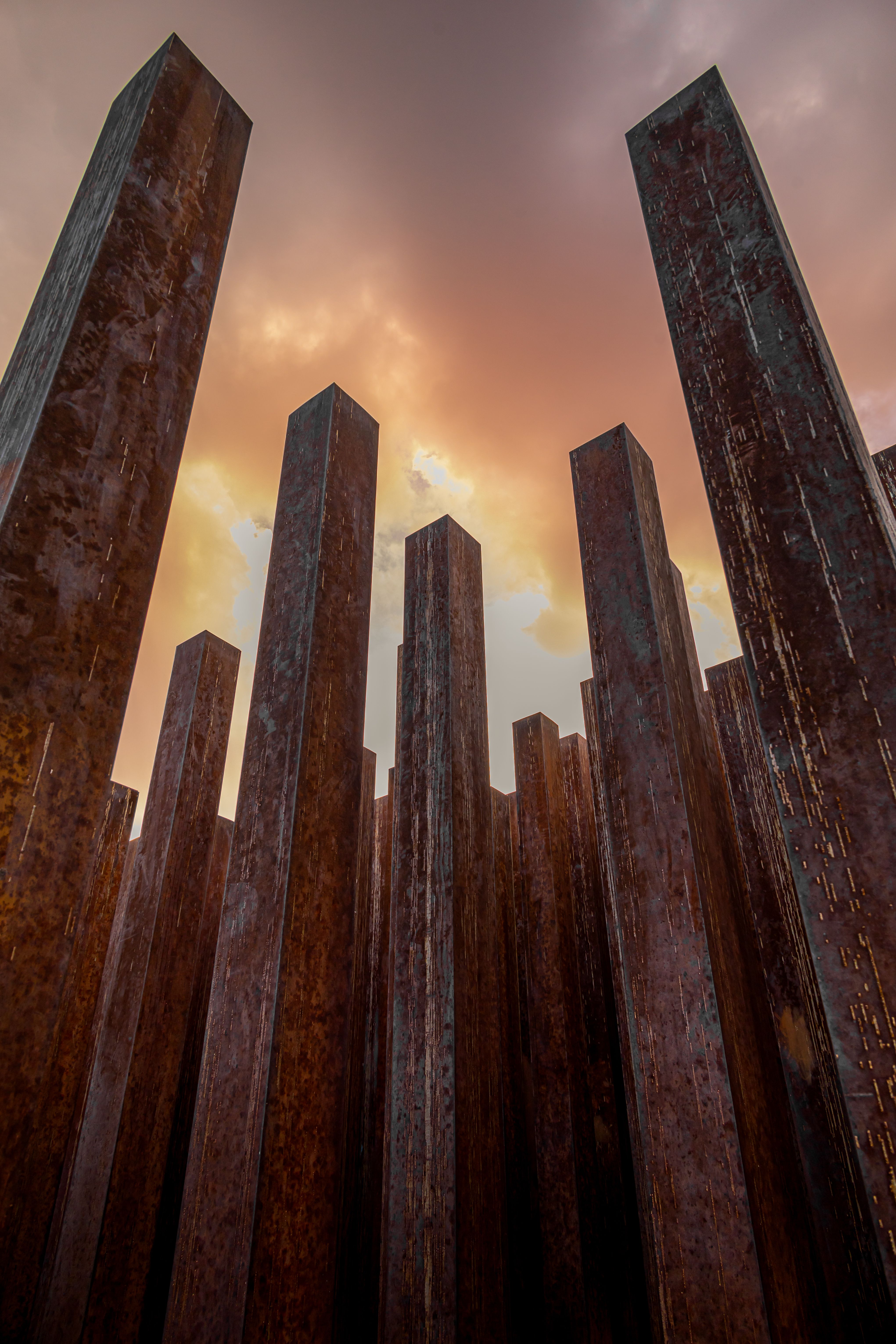 A photo of a wooden structure with a sunset · Free Stock Photo