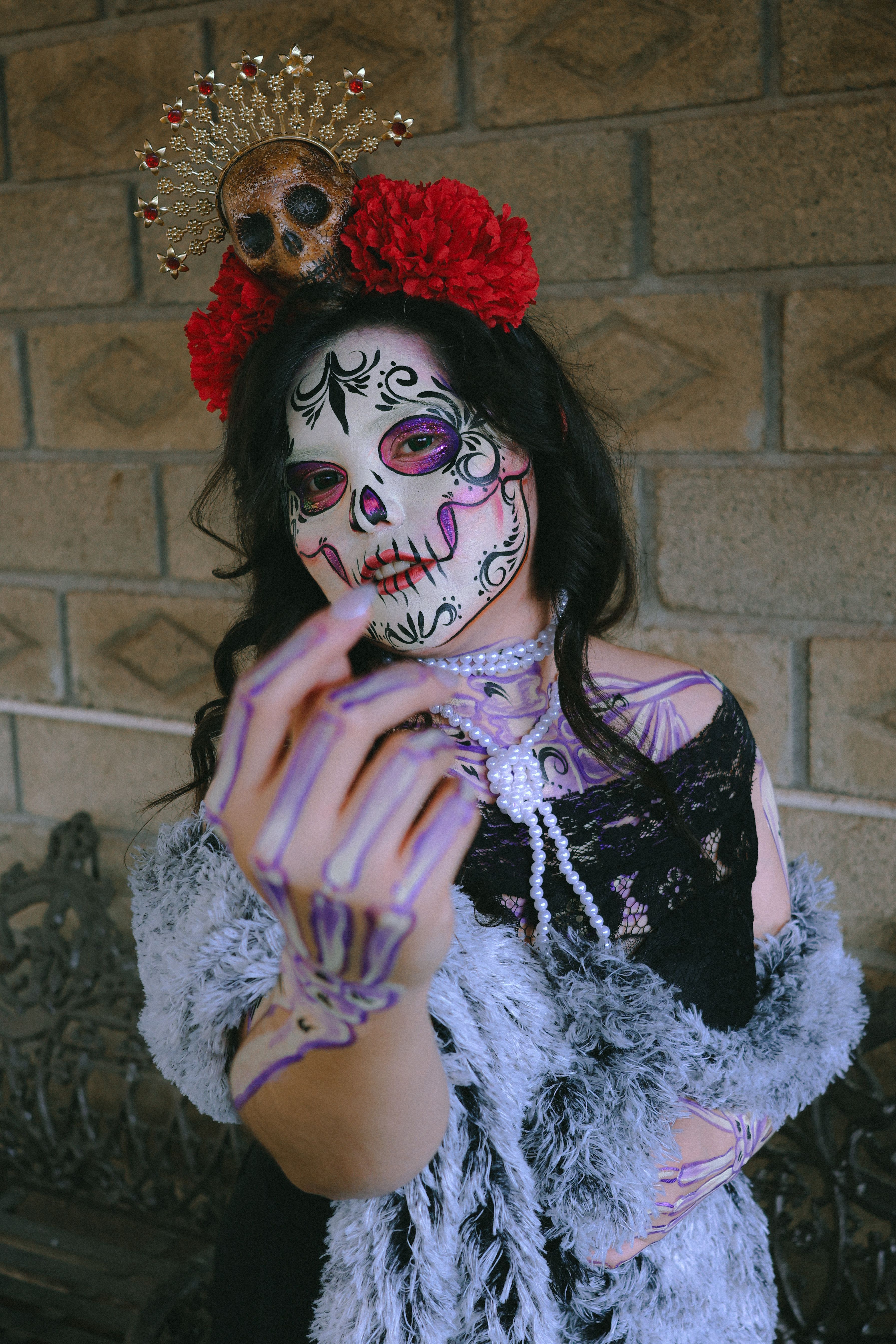 A woman in a skeleton costume with makeup on her face · Free Stock Photo