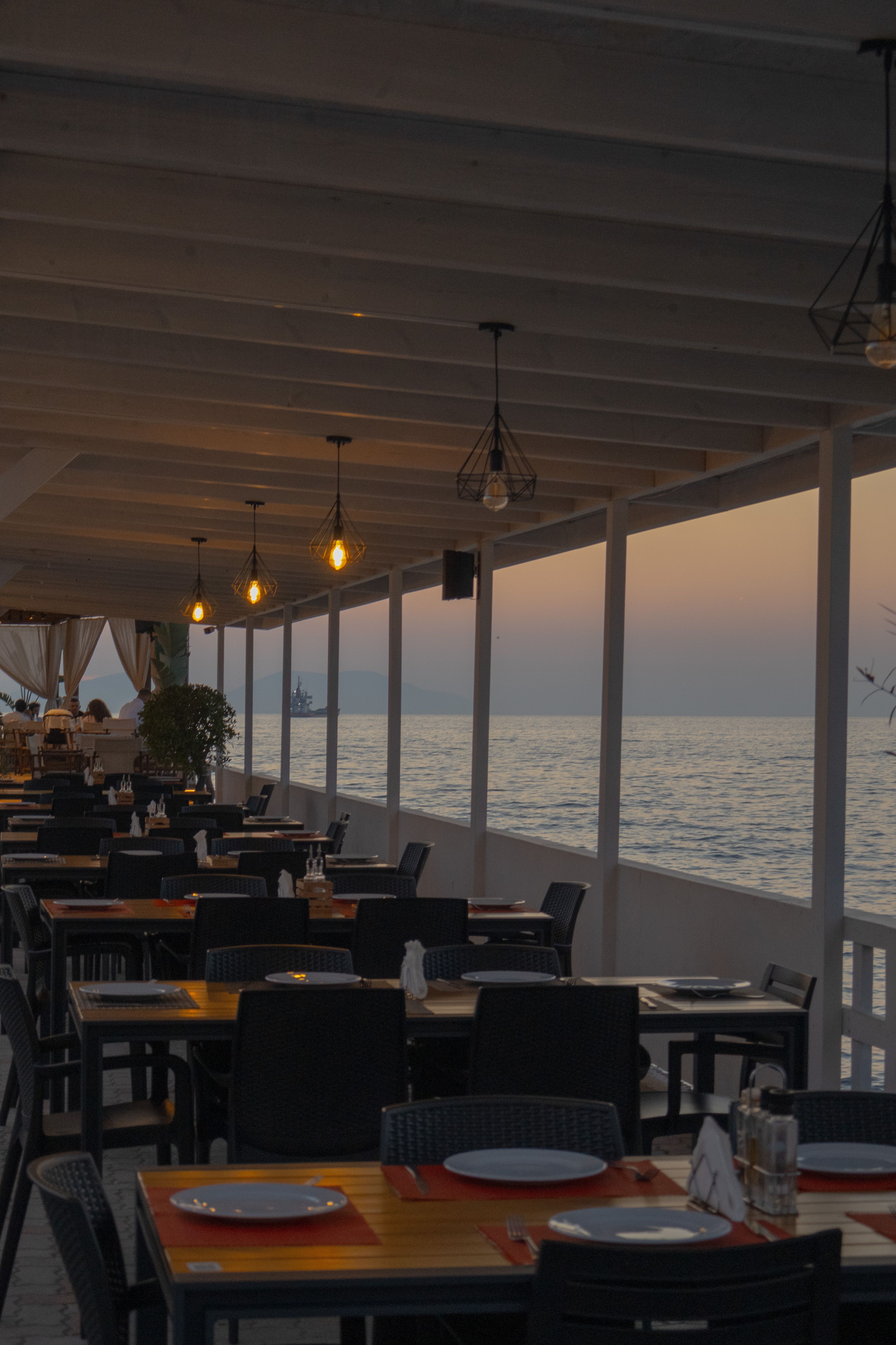 Seaside Dining at Sunset in Vlora · Free Stock Photo