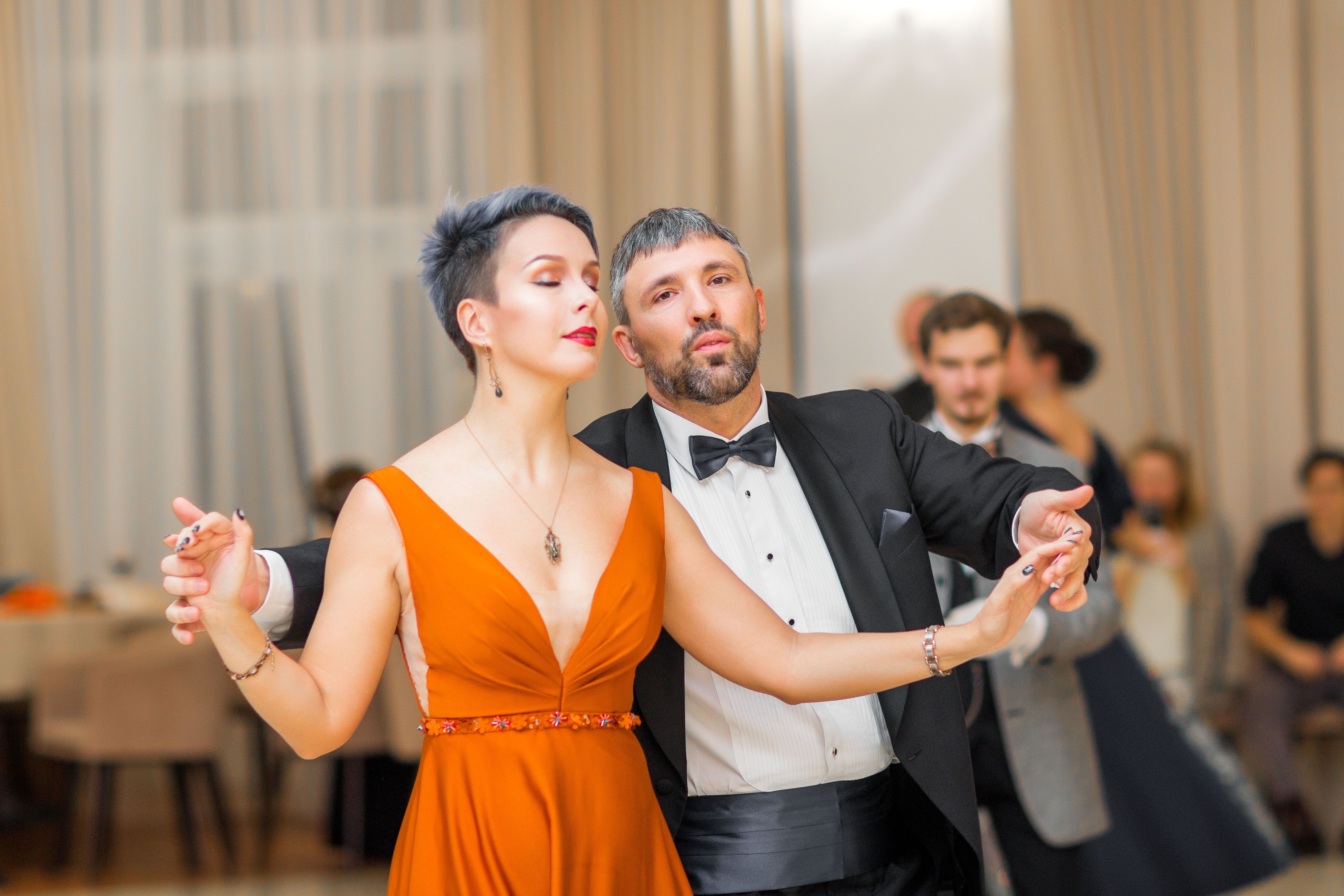A man and woman in formal attire dancing · Free Stock Photo