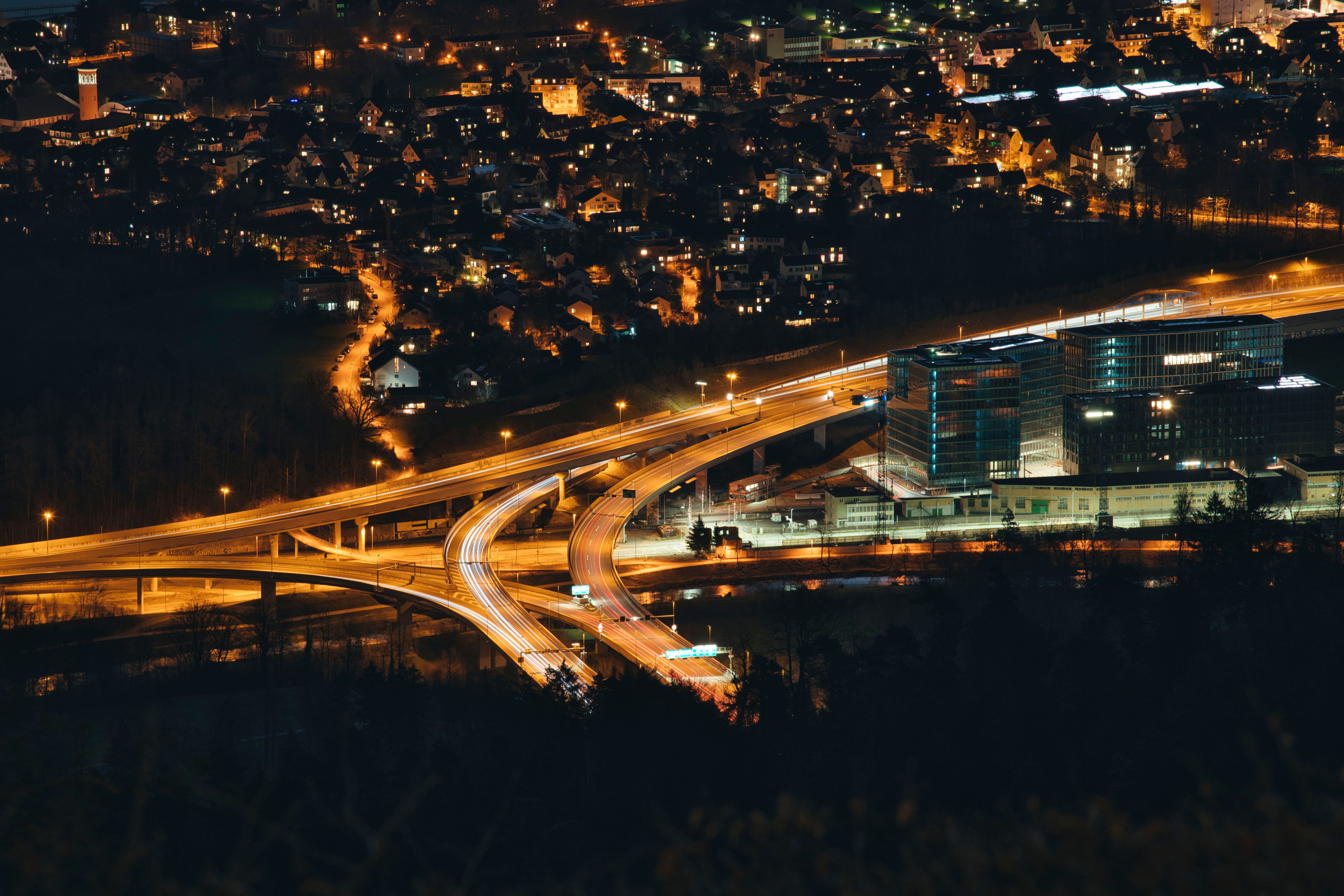 Aerial Night View of Illuminated City Highway · Free Stock Photo