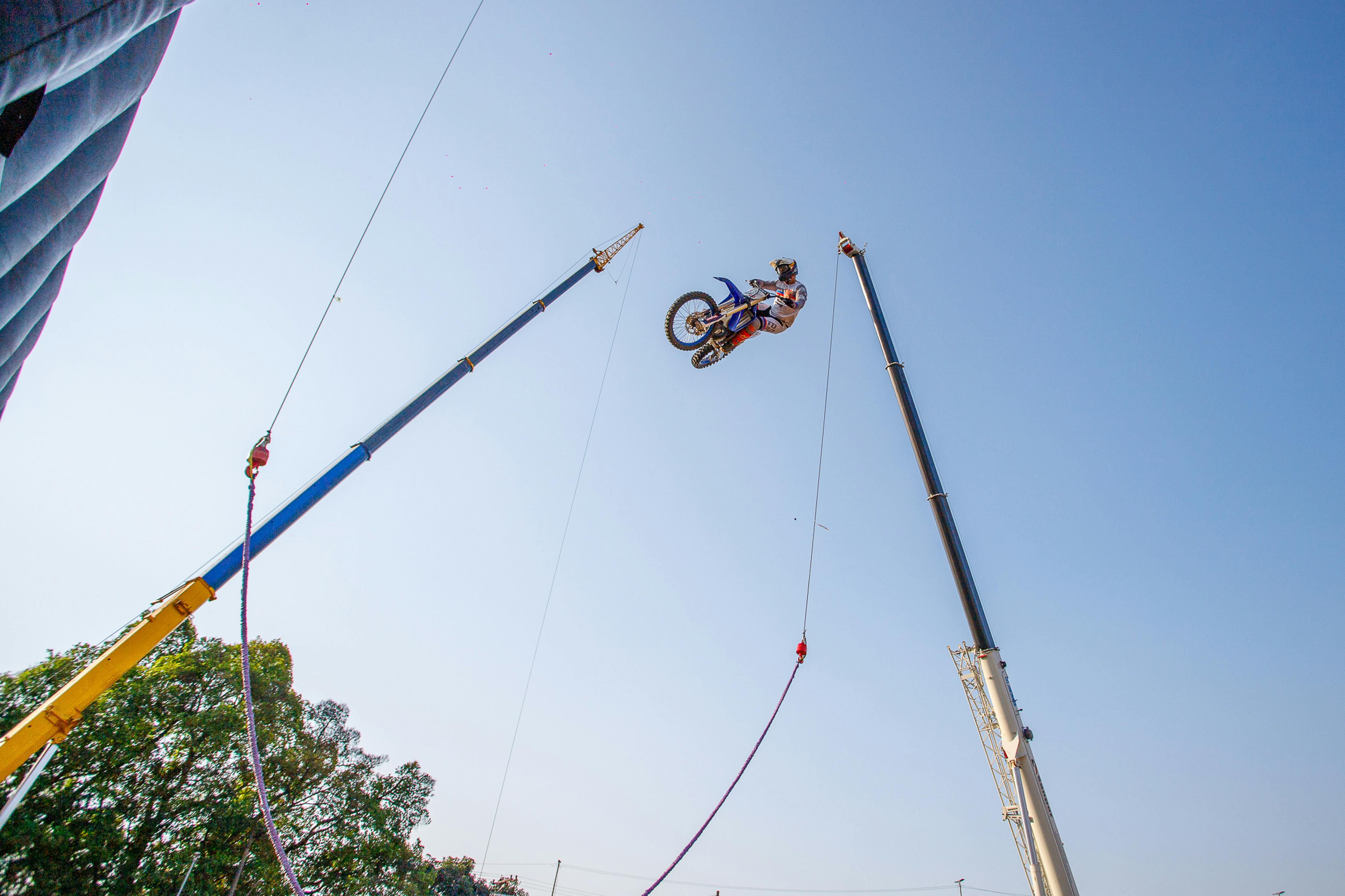 Extreme Motocross Stunt Under Blue Skies · Free Stock Photo