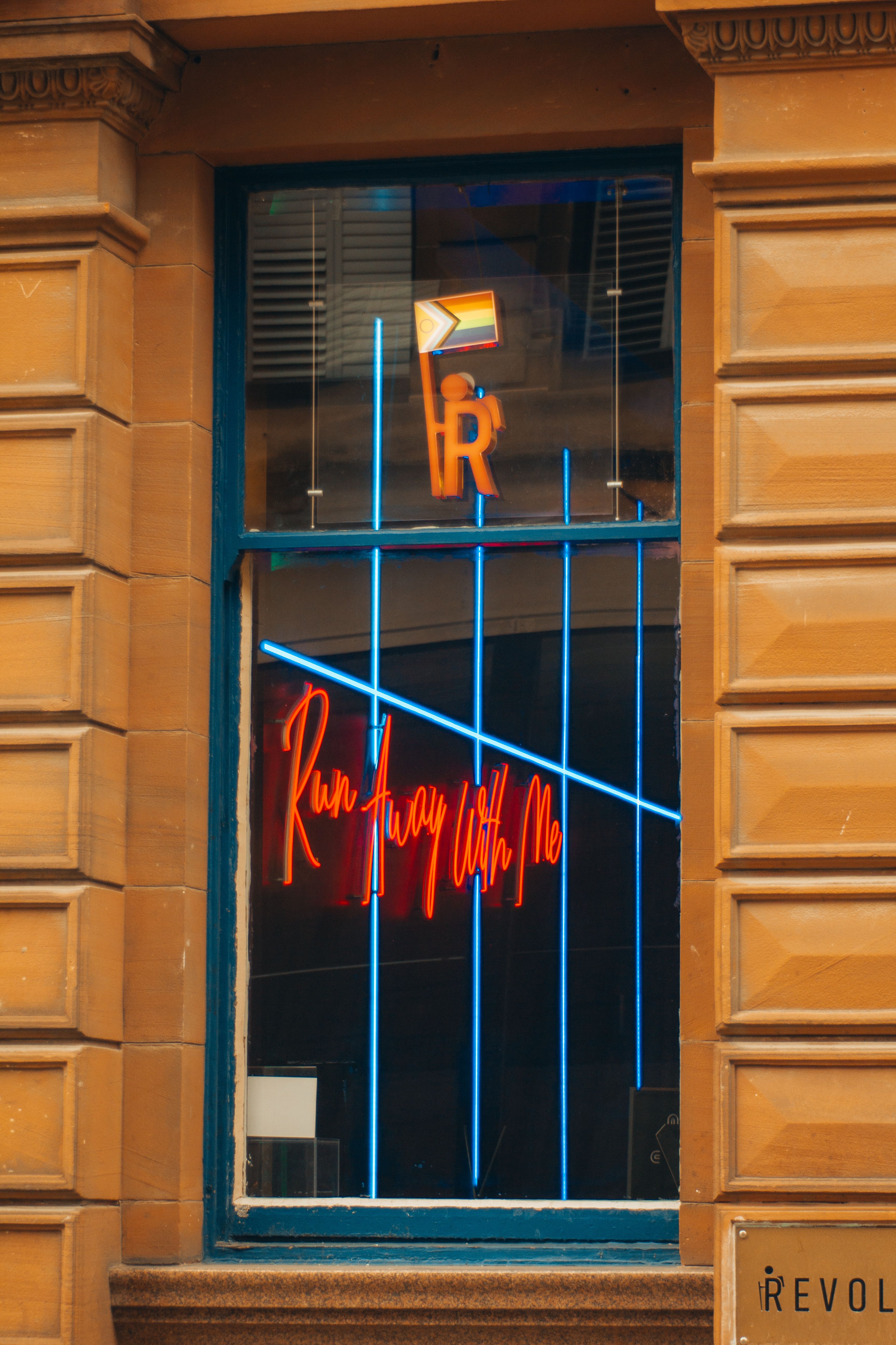 A Red Neon Sign Hanging in the Window · Free Stock Photo
