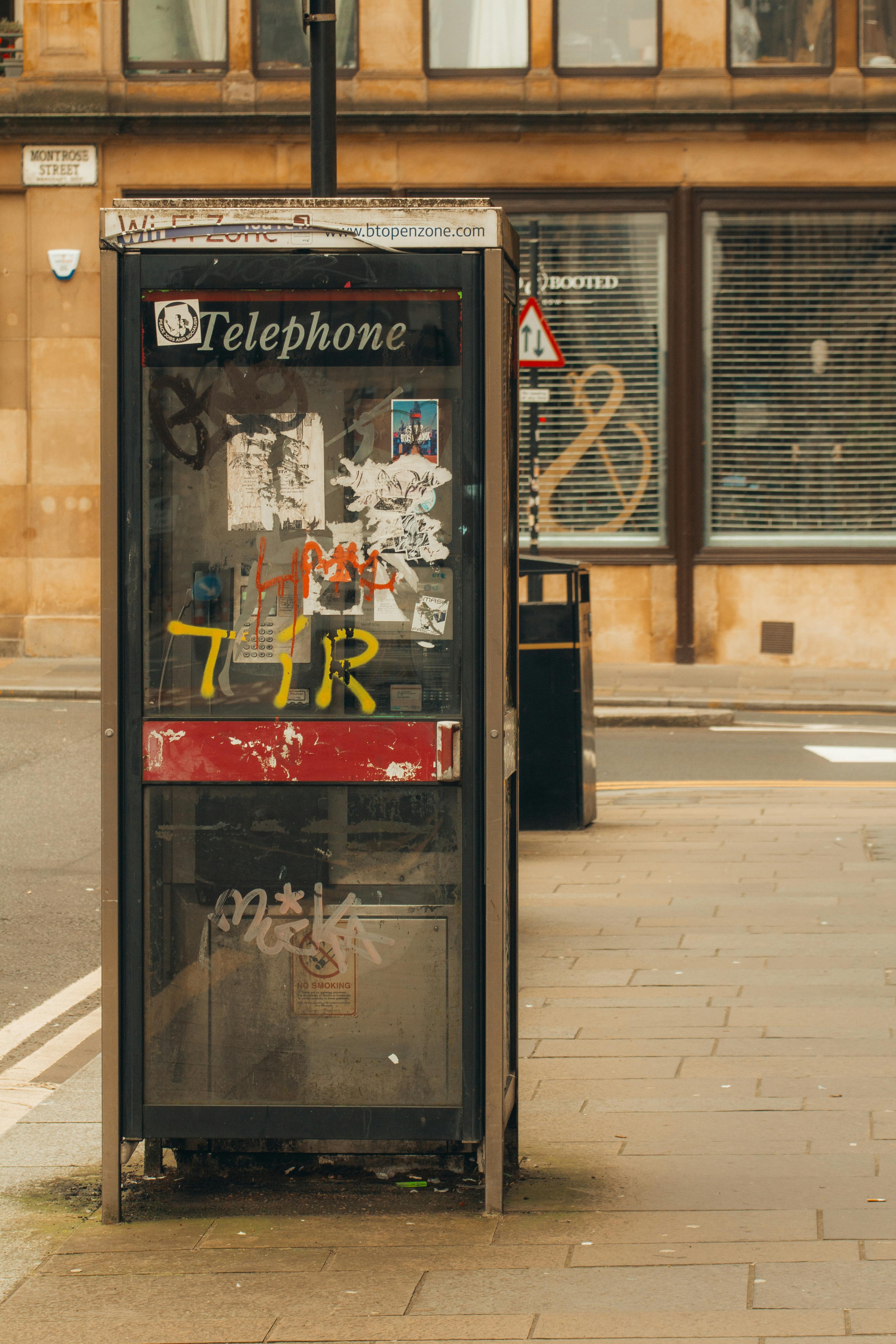 A phone booth with graffiti on it · Free Stock Photo
