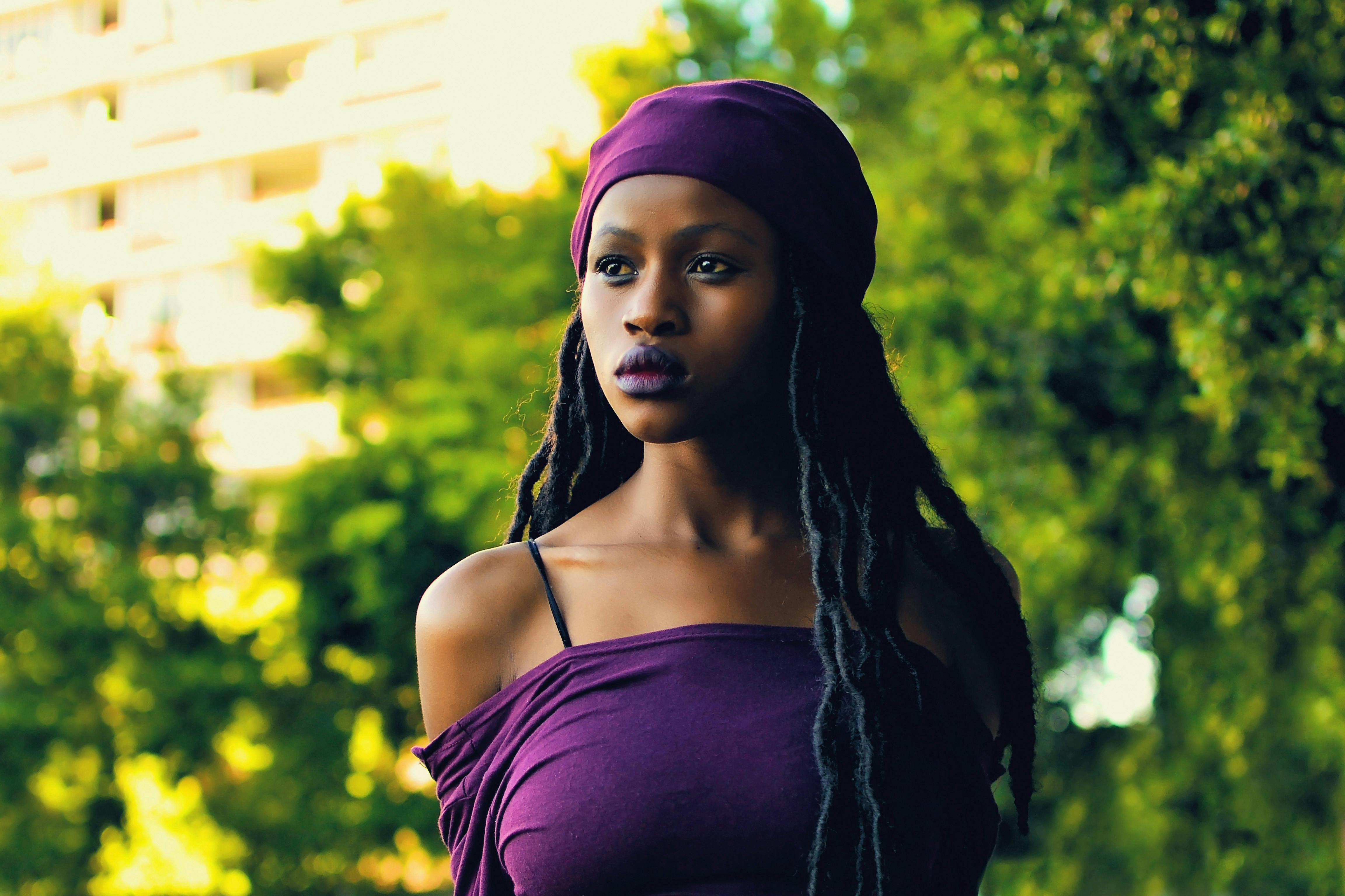 Female Model Wearing Long Locs and a Knit Hat · Free Stock Photo