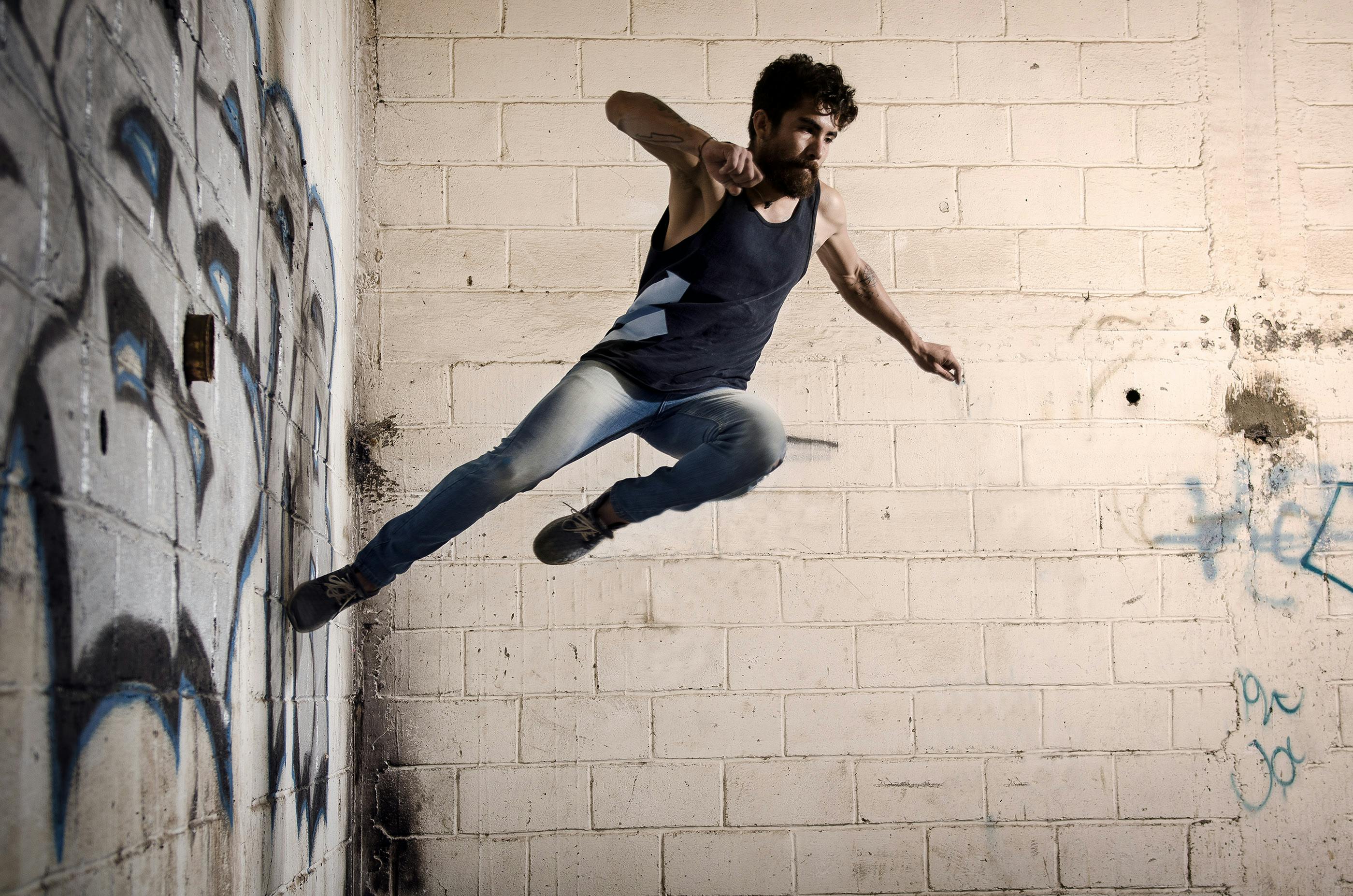 Dynamic Parkour Performer in Urban Setting · Free Stock Photo
