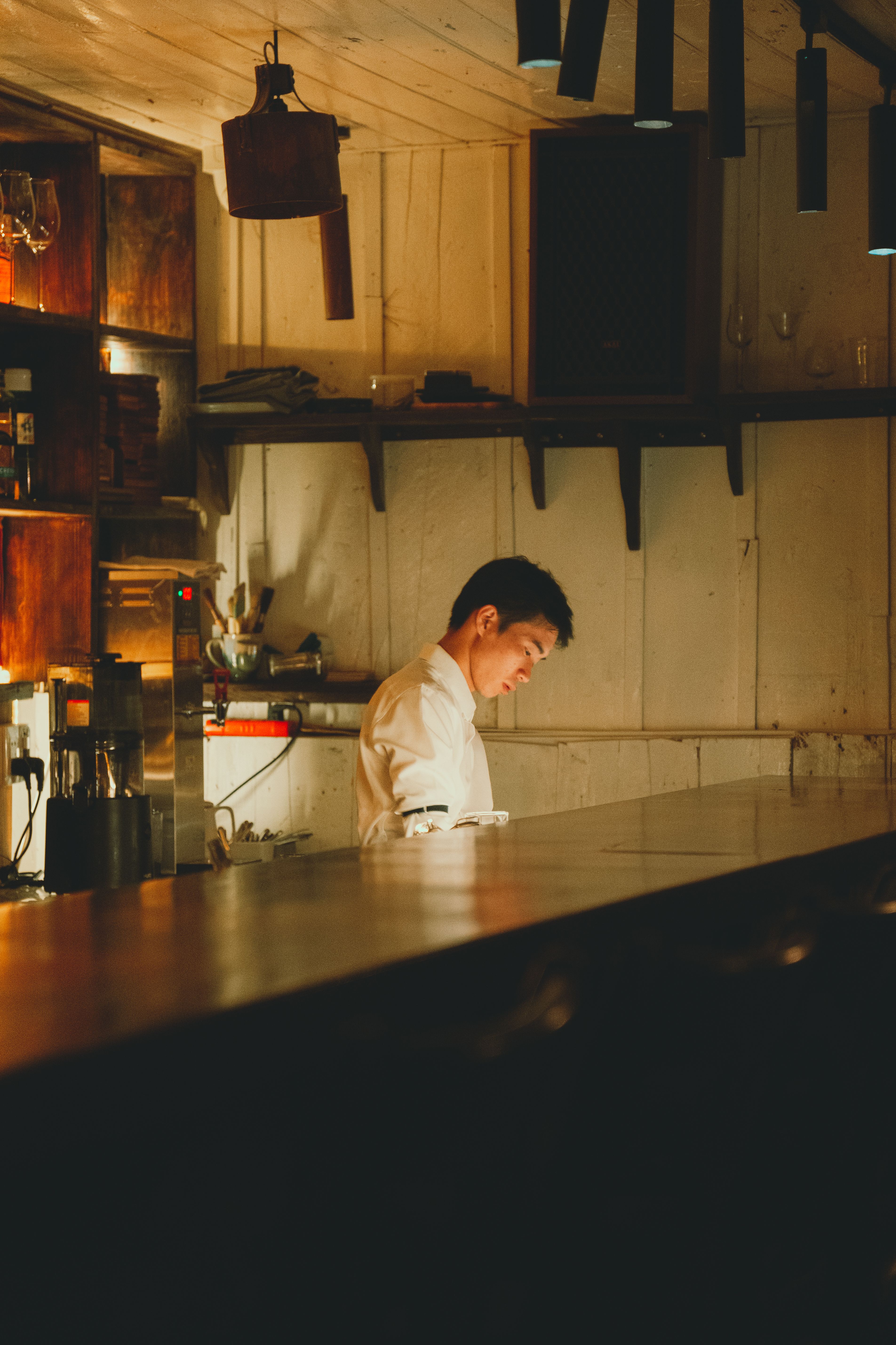 Candid Photo of a Chef Standing behind the Counter · Free Stock Photo