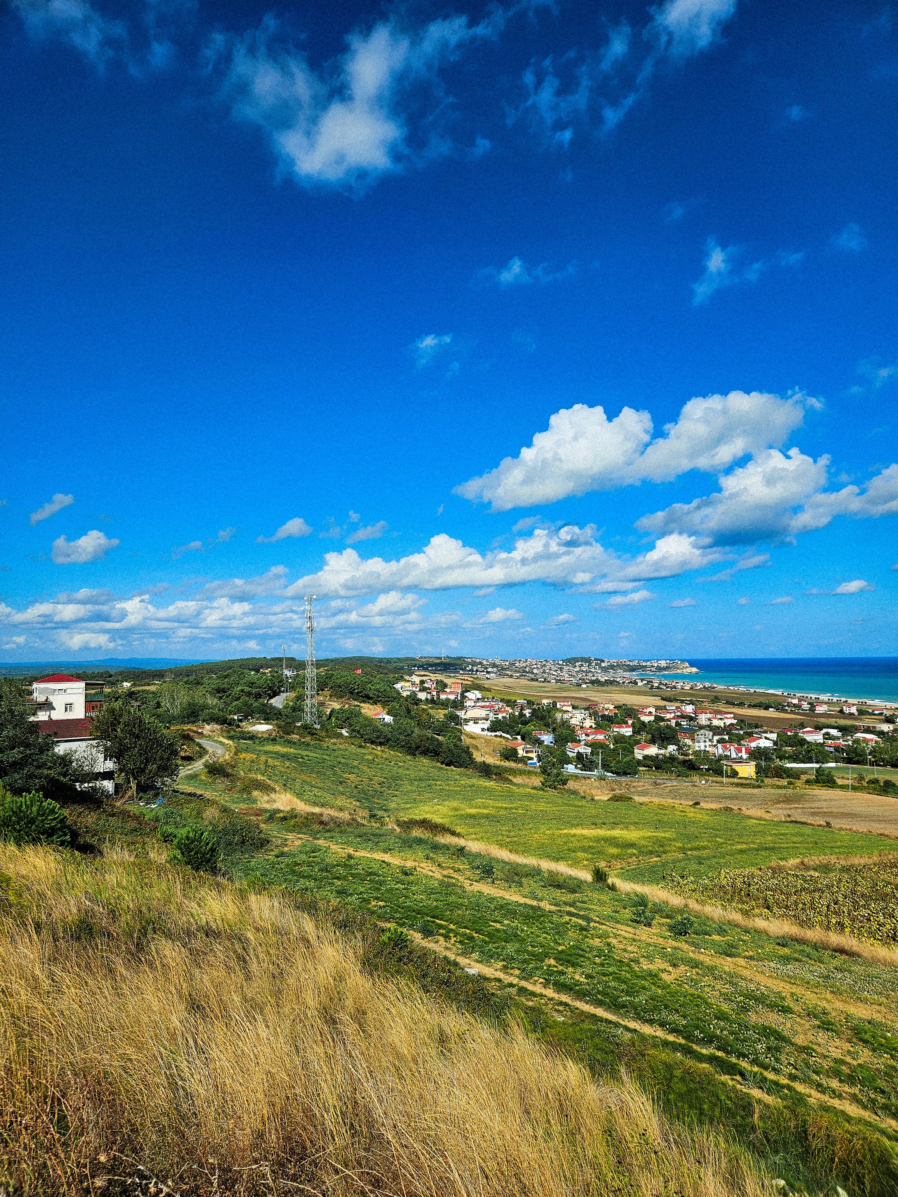 Grasslands Near Small Town in Countryside · Free Stock Photo