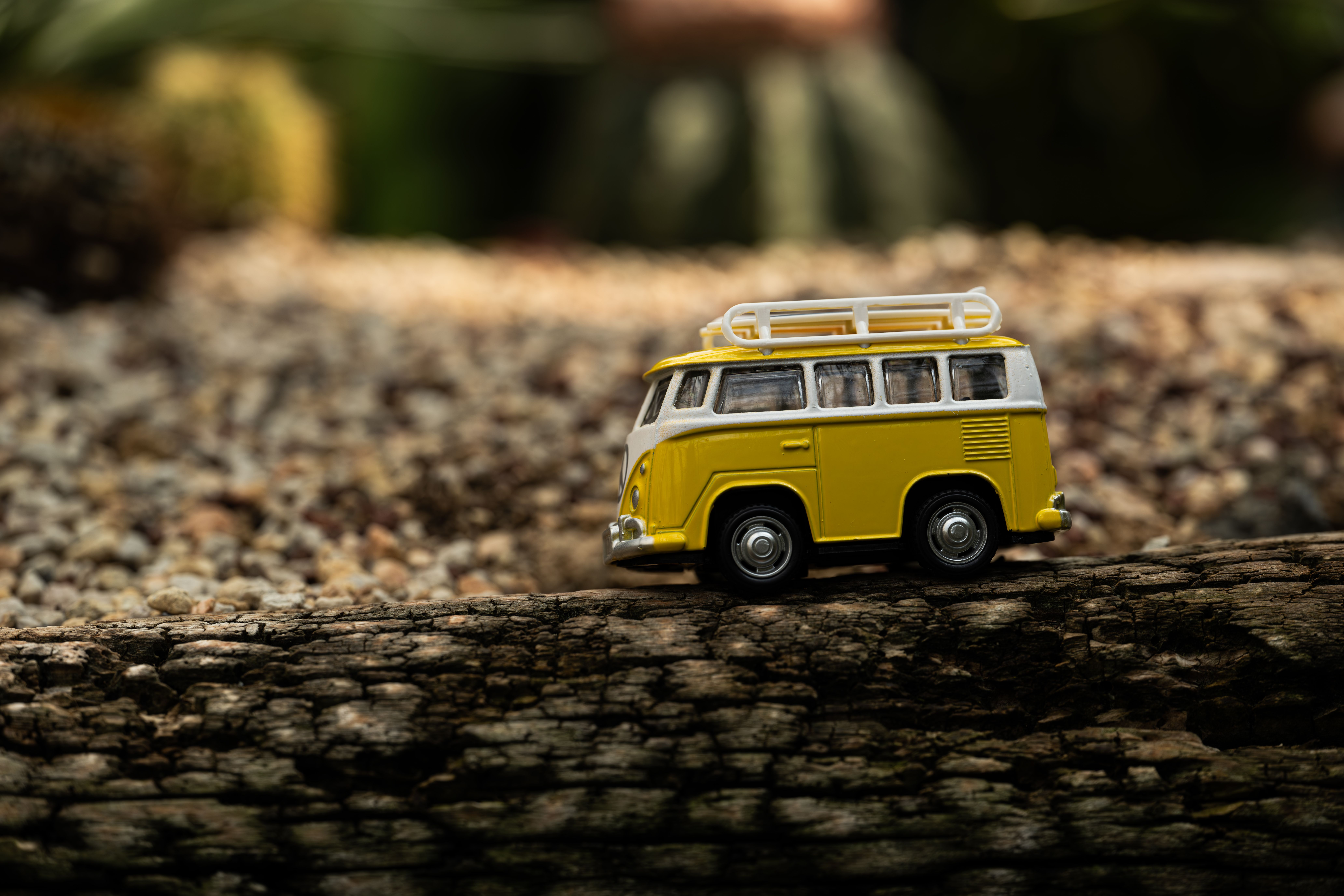 Yellow Van Figurine on the Ground · Free Stock Photo