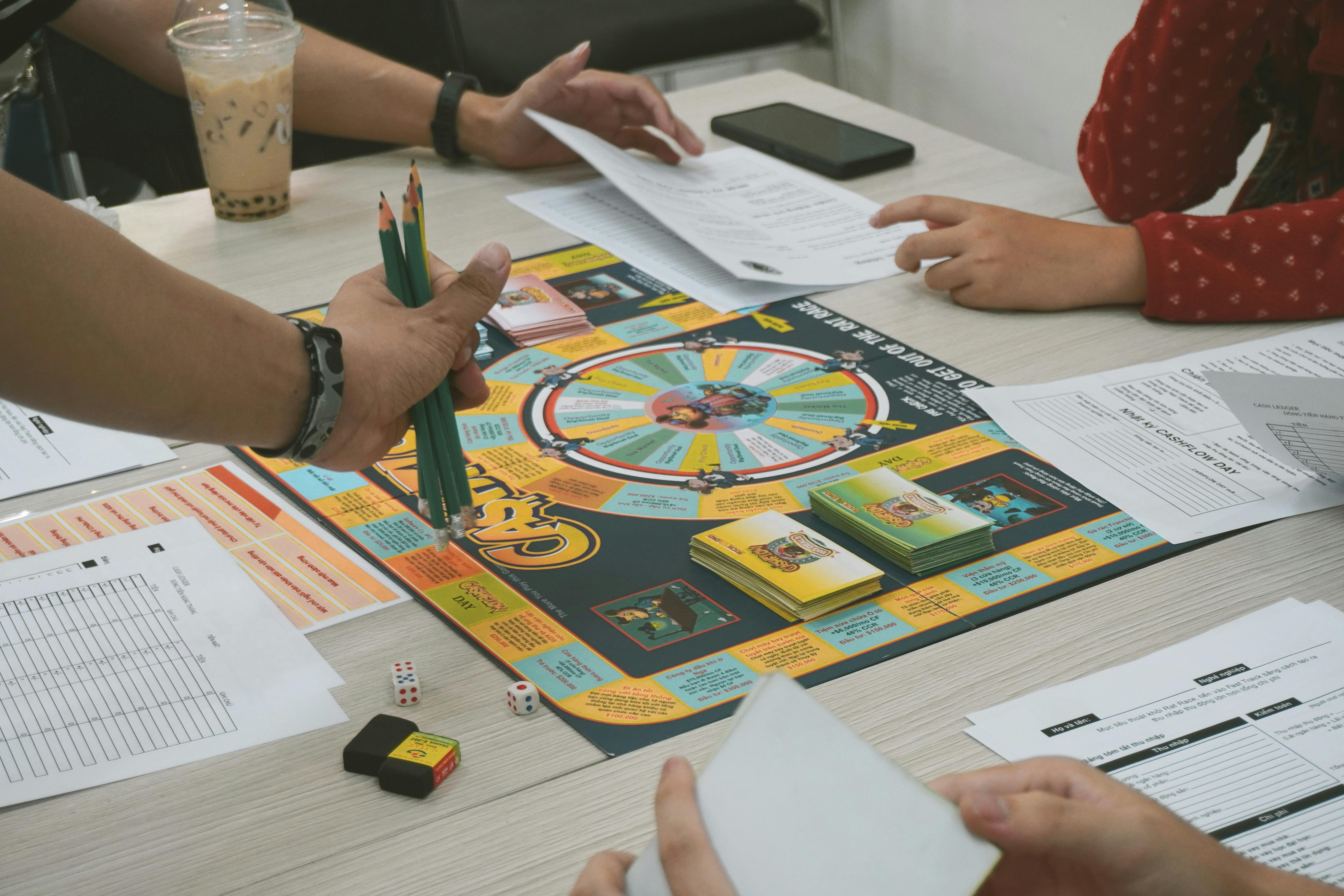 A group of people playing a board game · Free Stock Photo