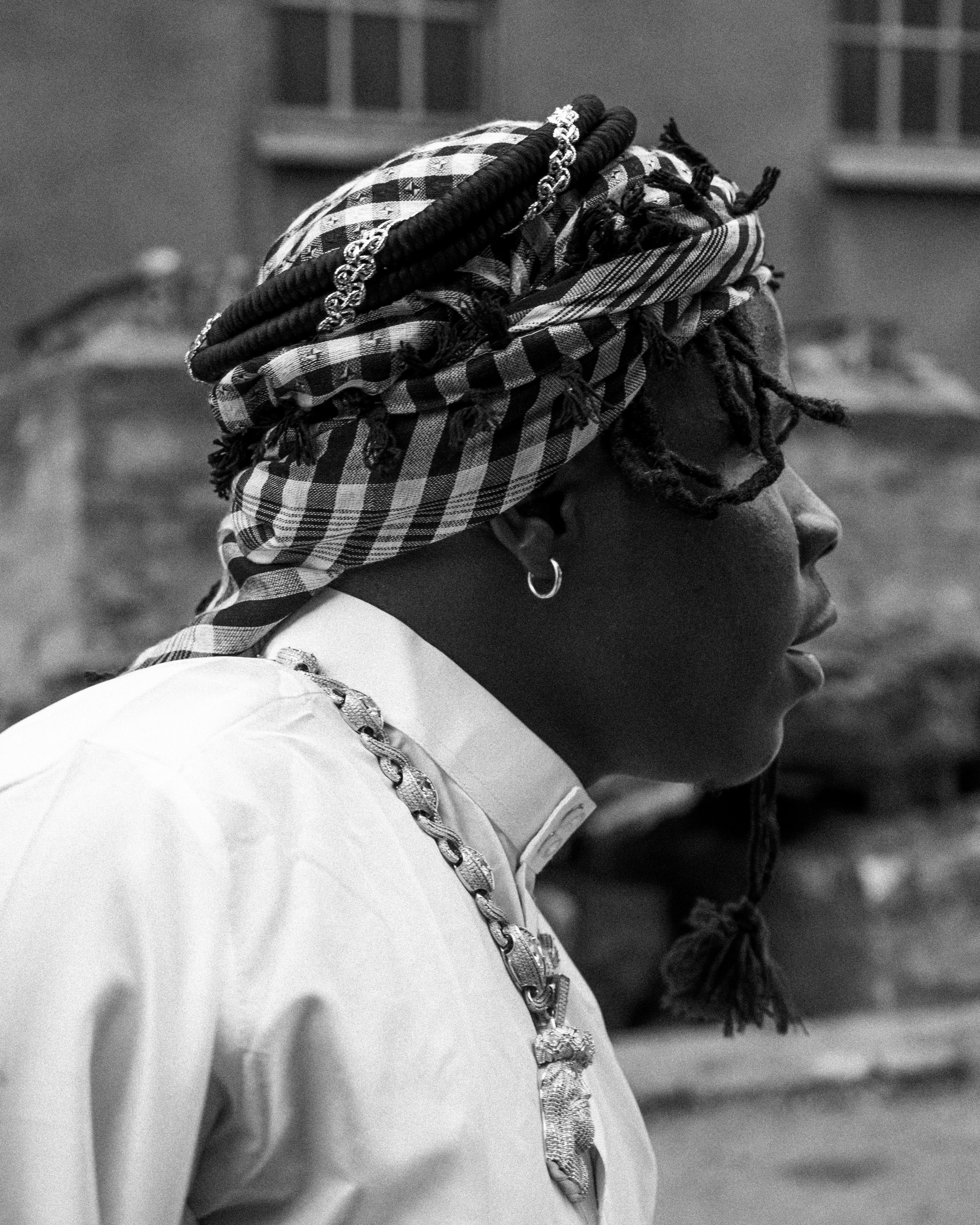Side View of a Man Wearing Traditional Clothing with a Turban Standing ...