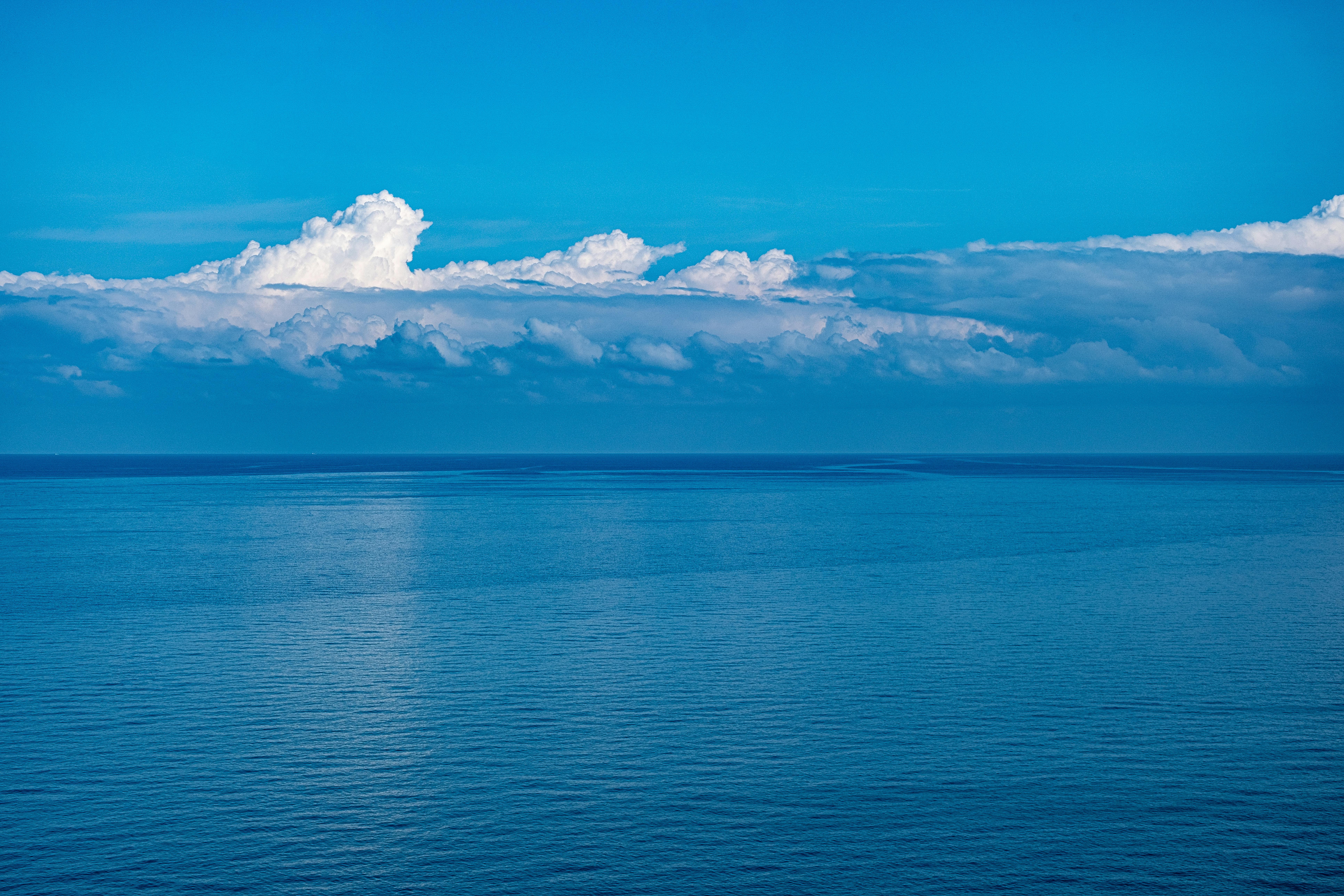 Aerial View of a Blue Sea under a Blue Sky · Free Stock Photo