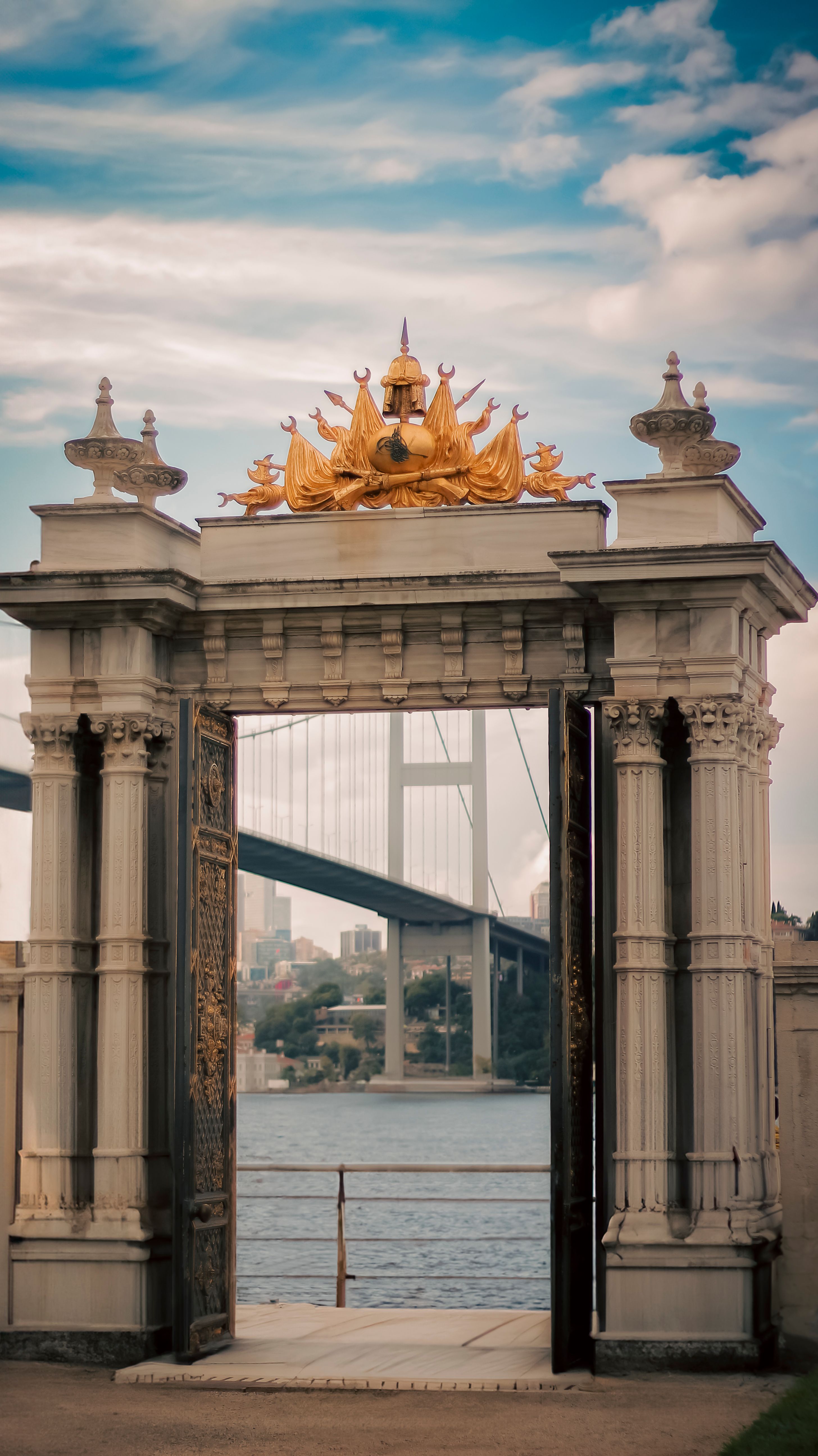 A gate with a bridge in the background · Free Stock Photo