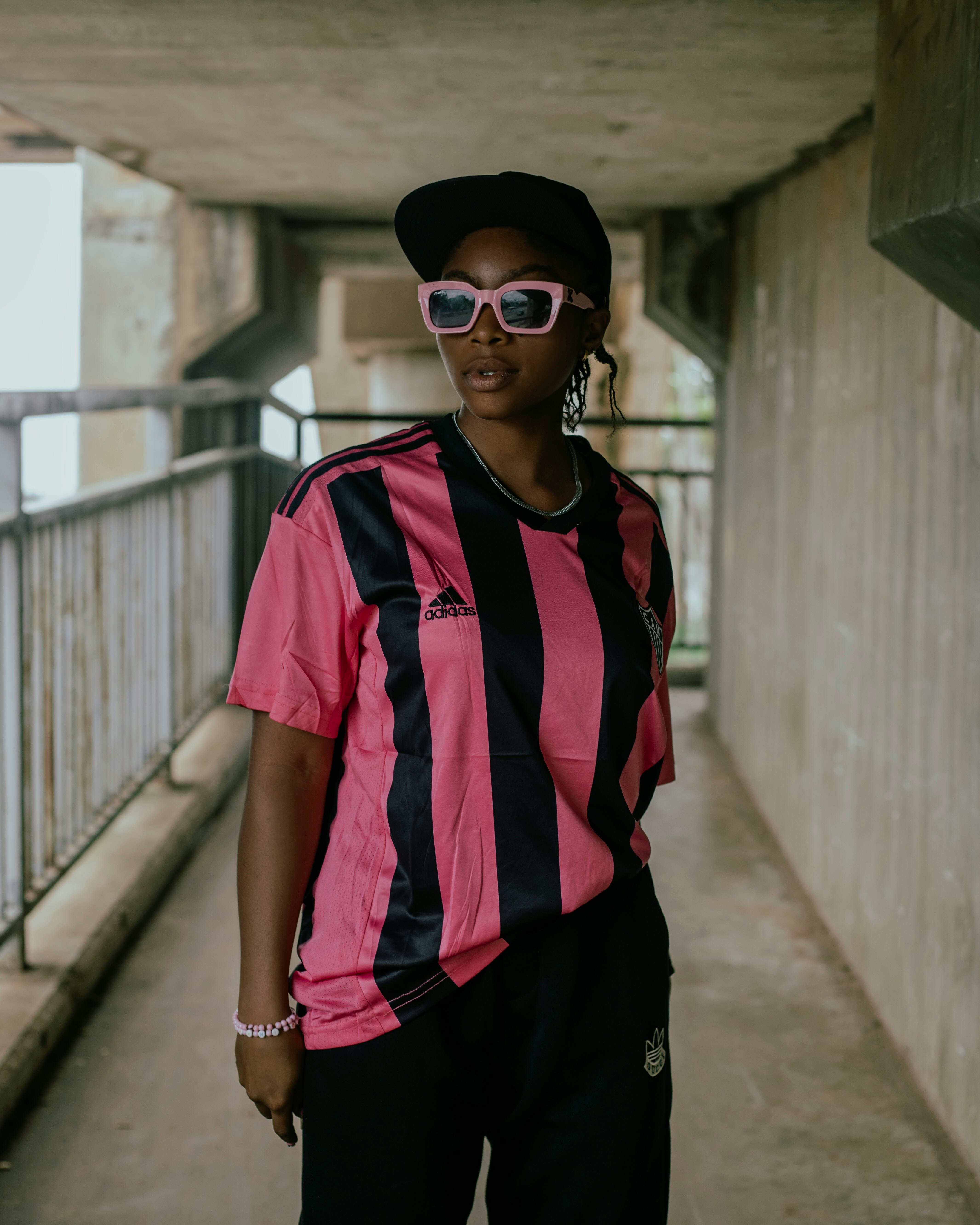 Serious black man putting on hood · Free Stock Photo