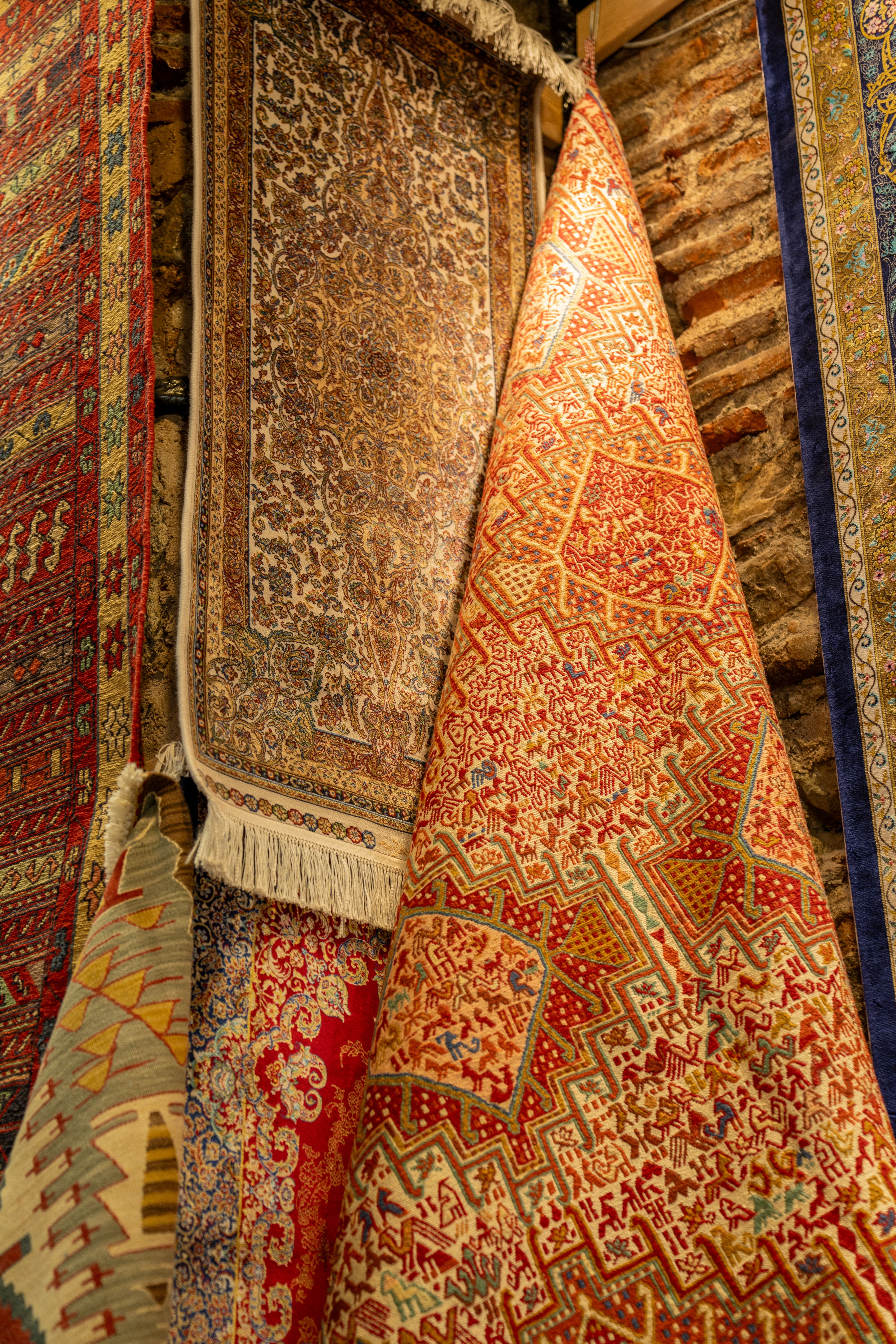 Rugs Hanging in a Market · Free Stock Photo