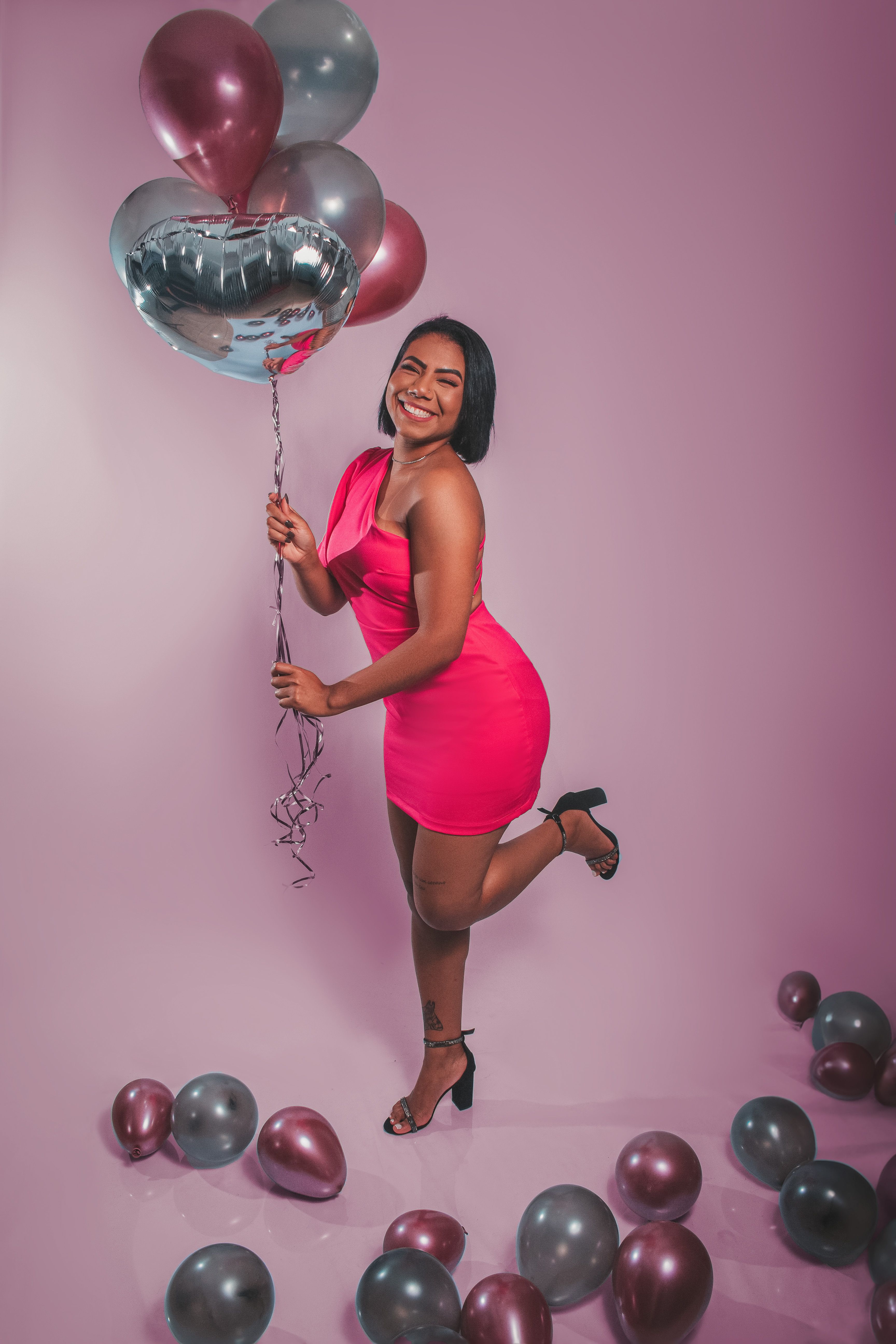 Woman Holding Balloons · Free Stock Photo