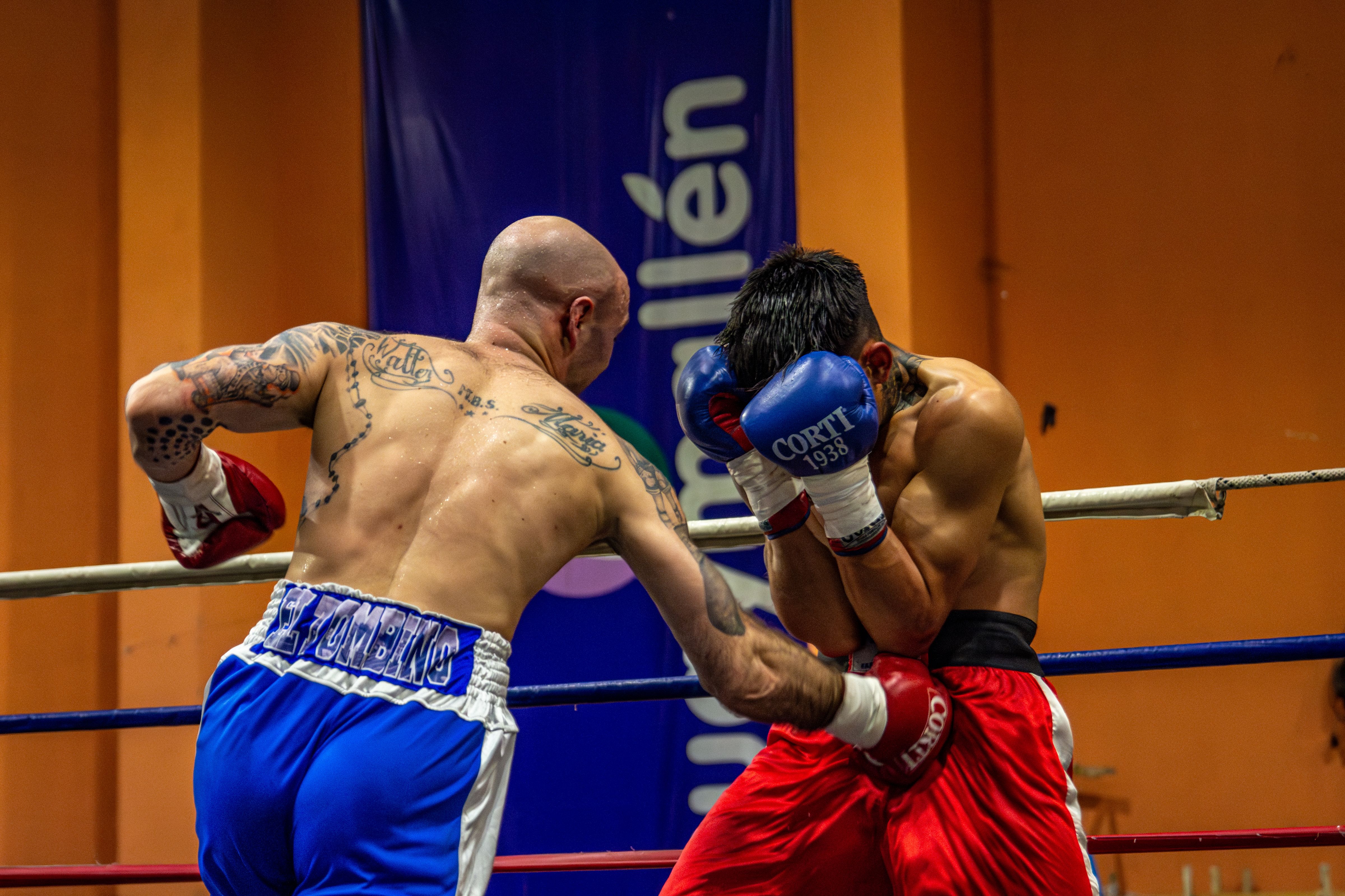 Low-Angle Photo of Two Men Fighting in Boxing Ring · Free Stock Photo