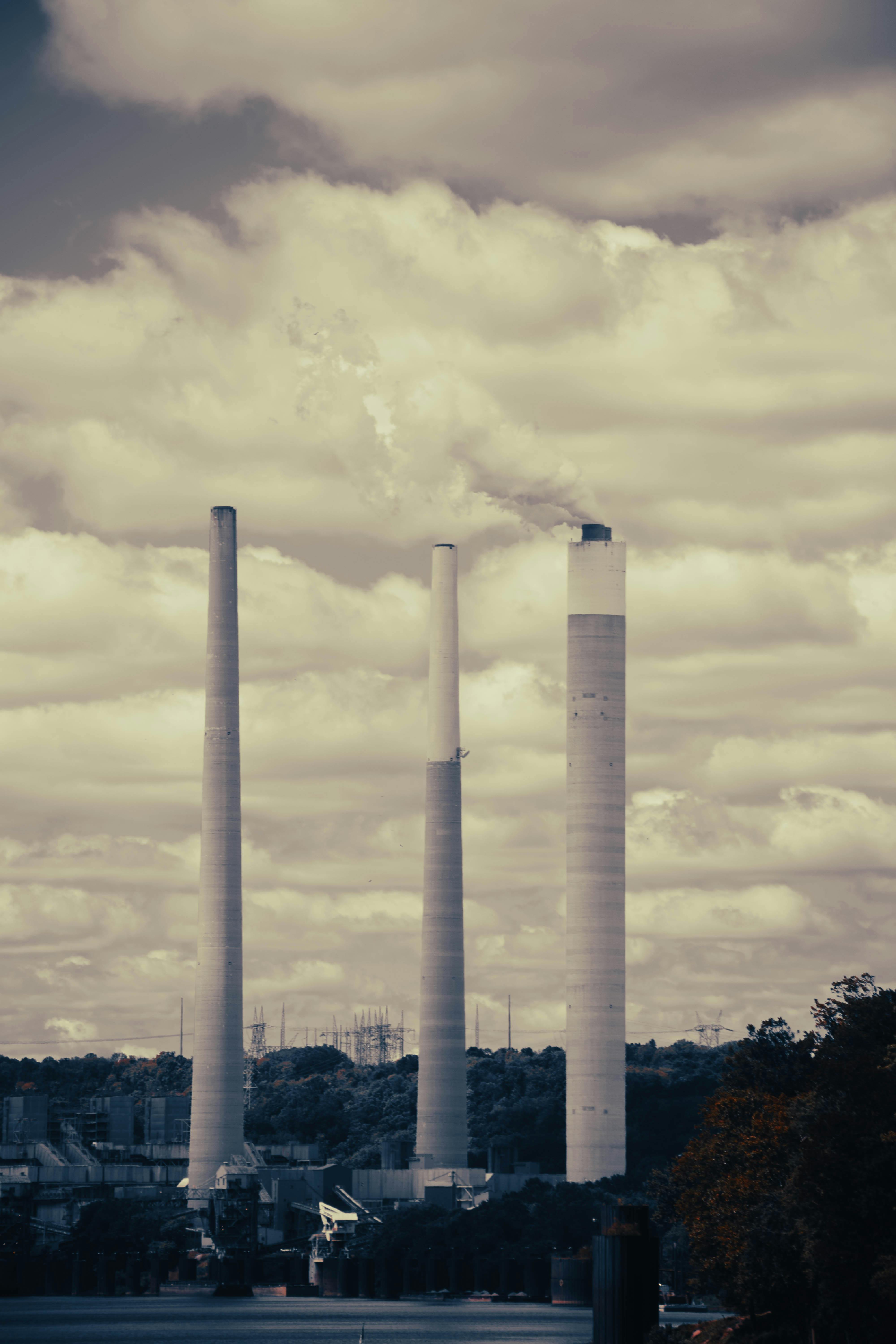 Brown and White Factory Building during Night Time · Free Stock Photo