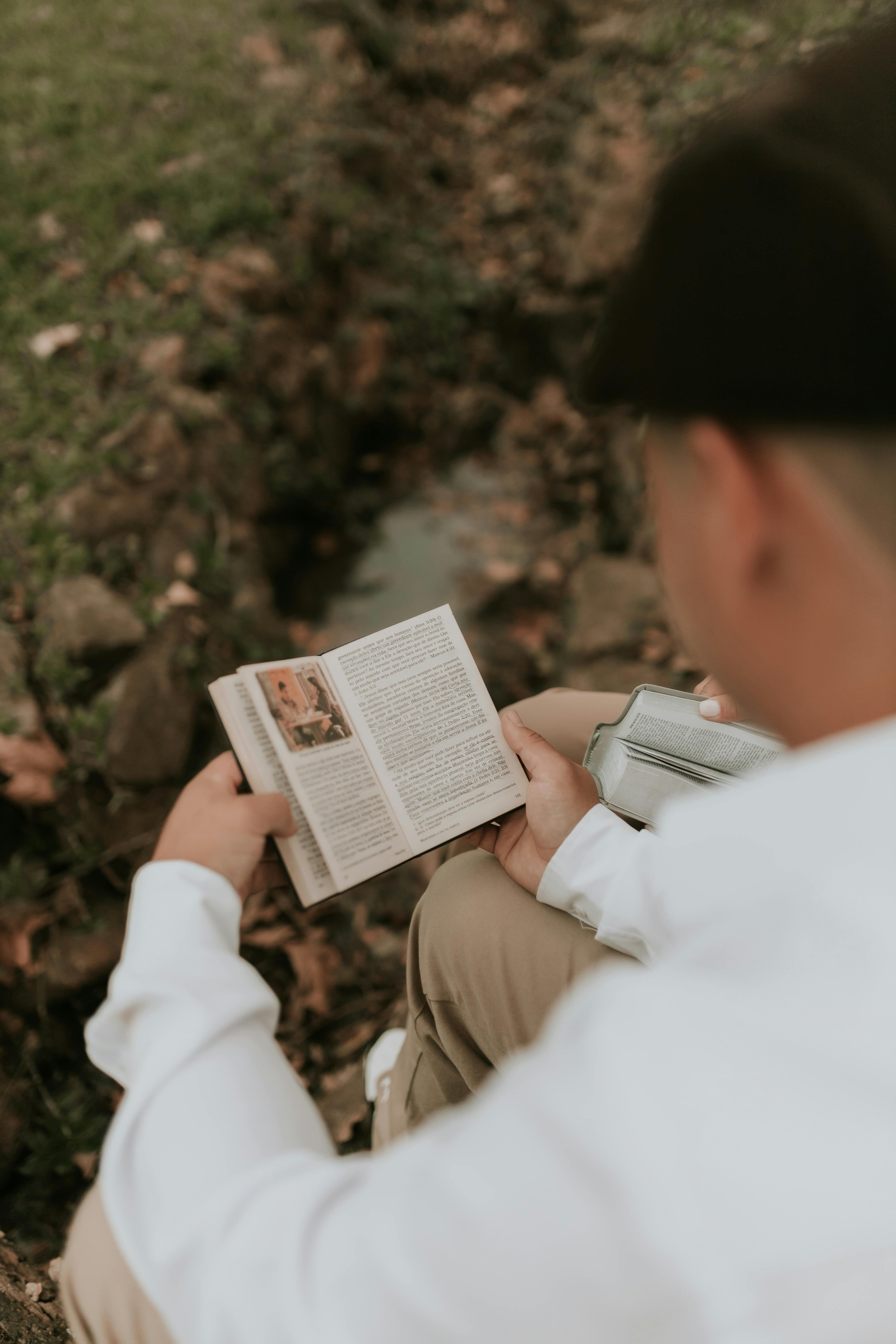Man Wearing Black Suit Reading Book · Free Stock Photo