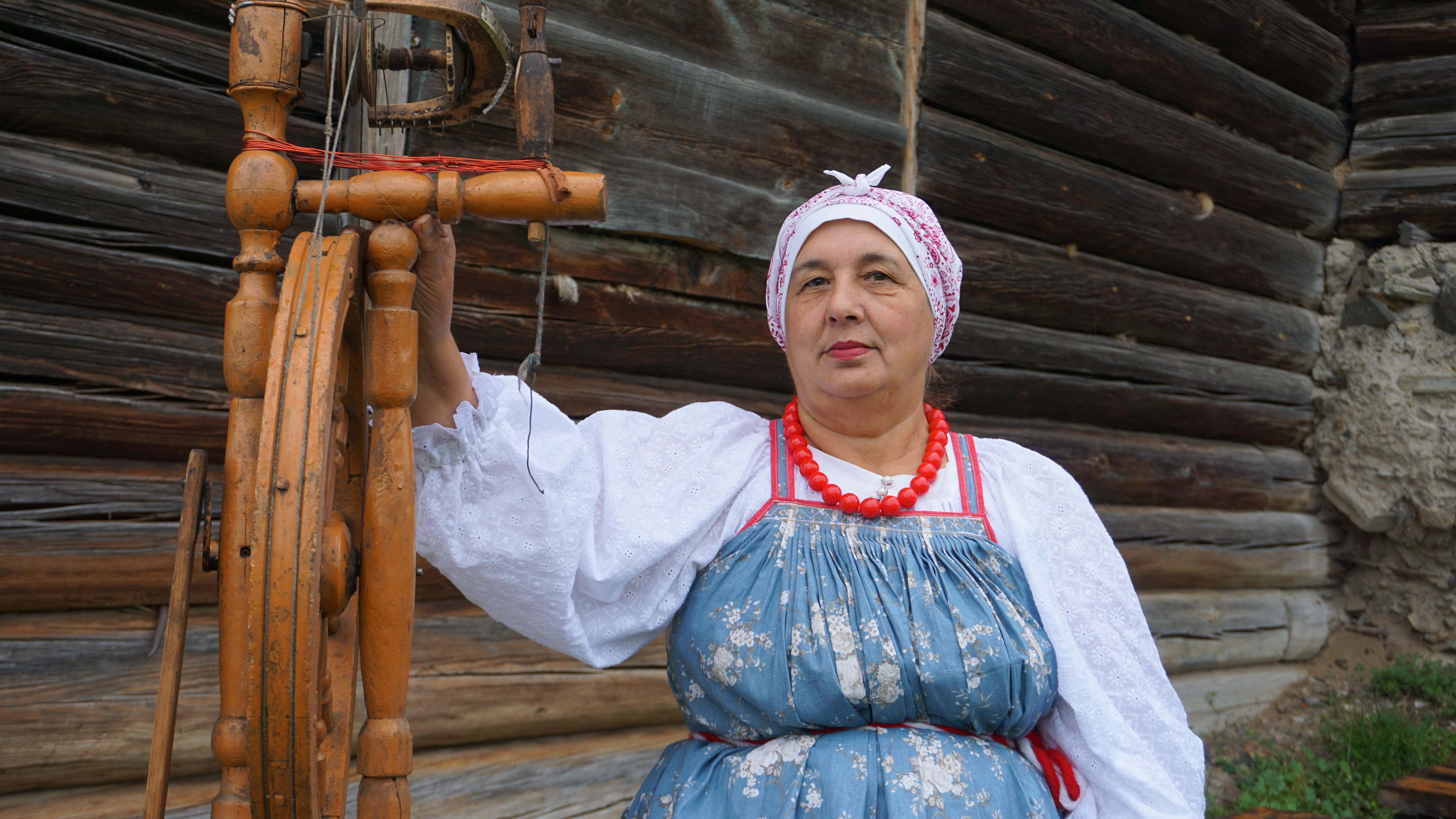 Elderly Woman Wearing Traditional Costume on Farm · Free Stock Photo