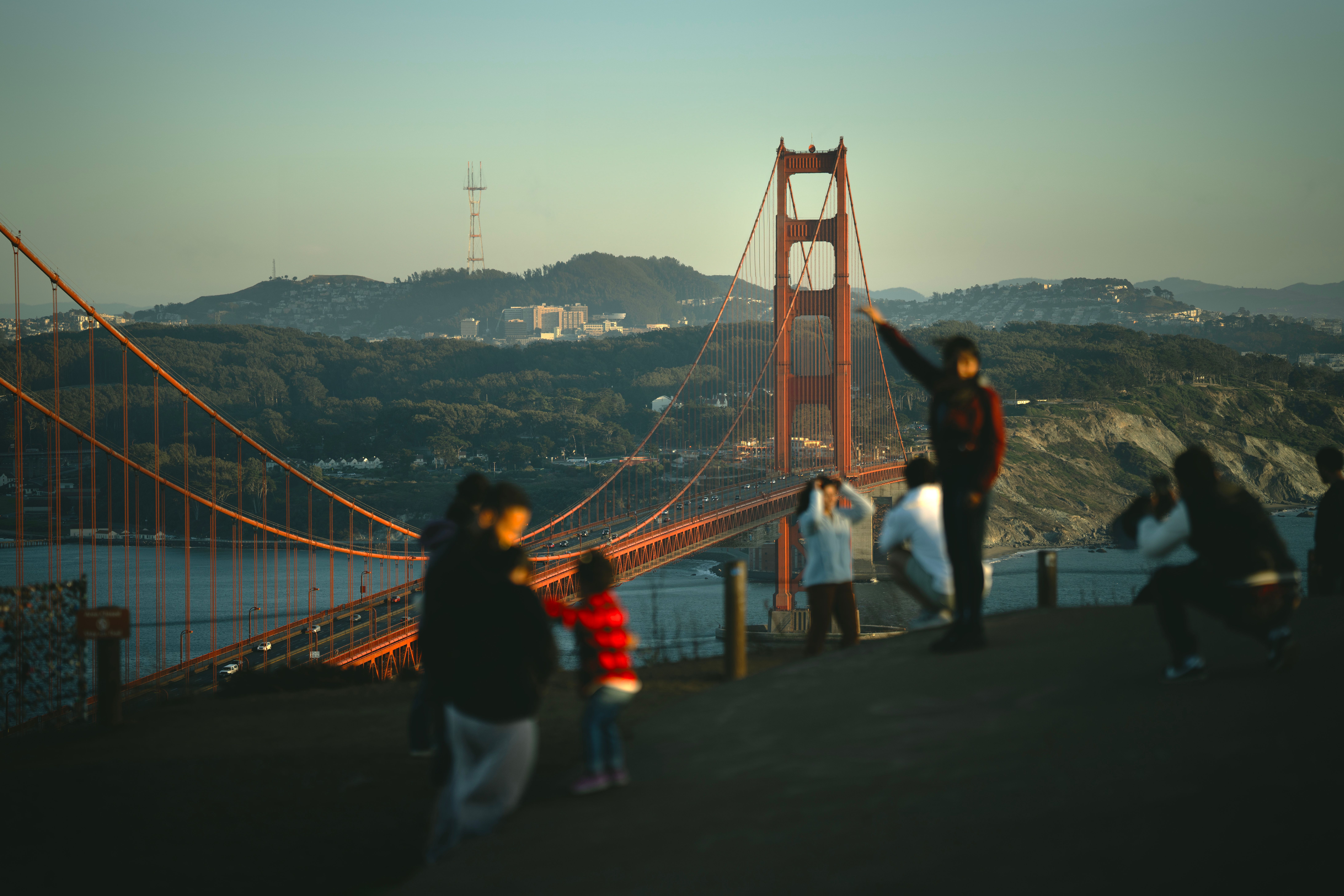 A group of people standing on the golden gate bridge · Free Stock Photo